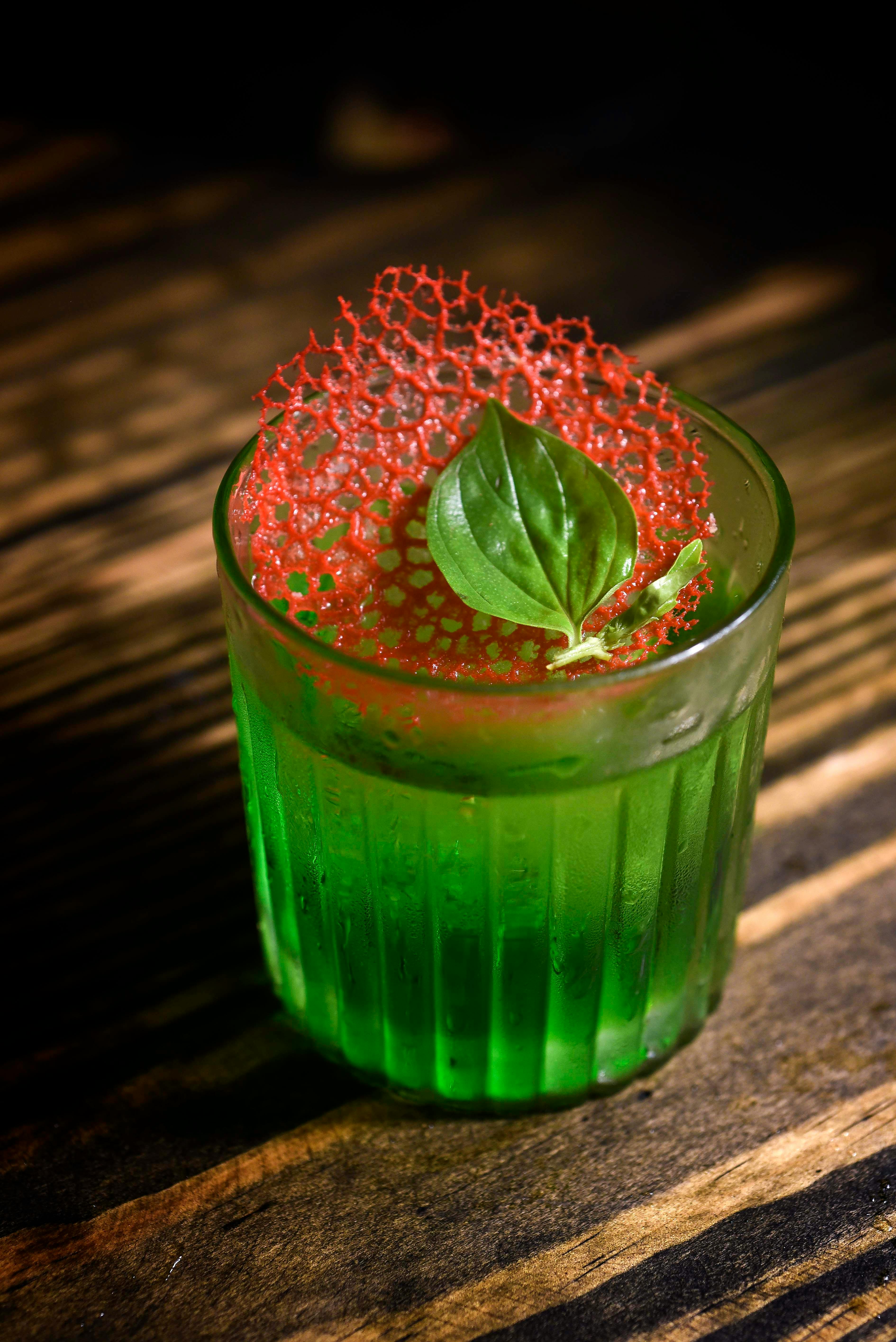 Vibrant Green Cocktail with Red Garnish · Free Stock Photo