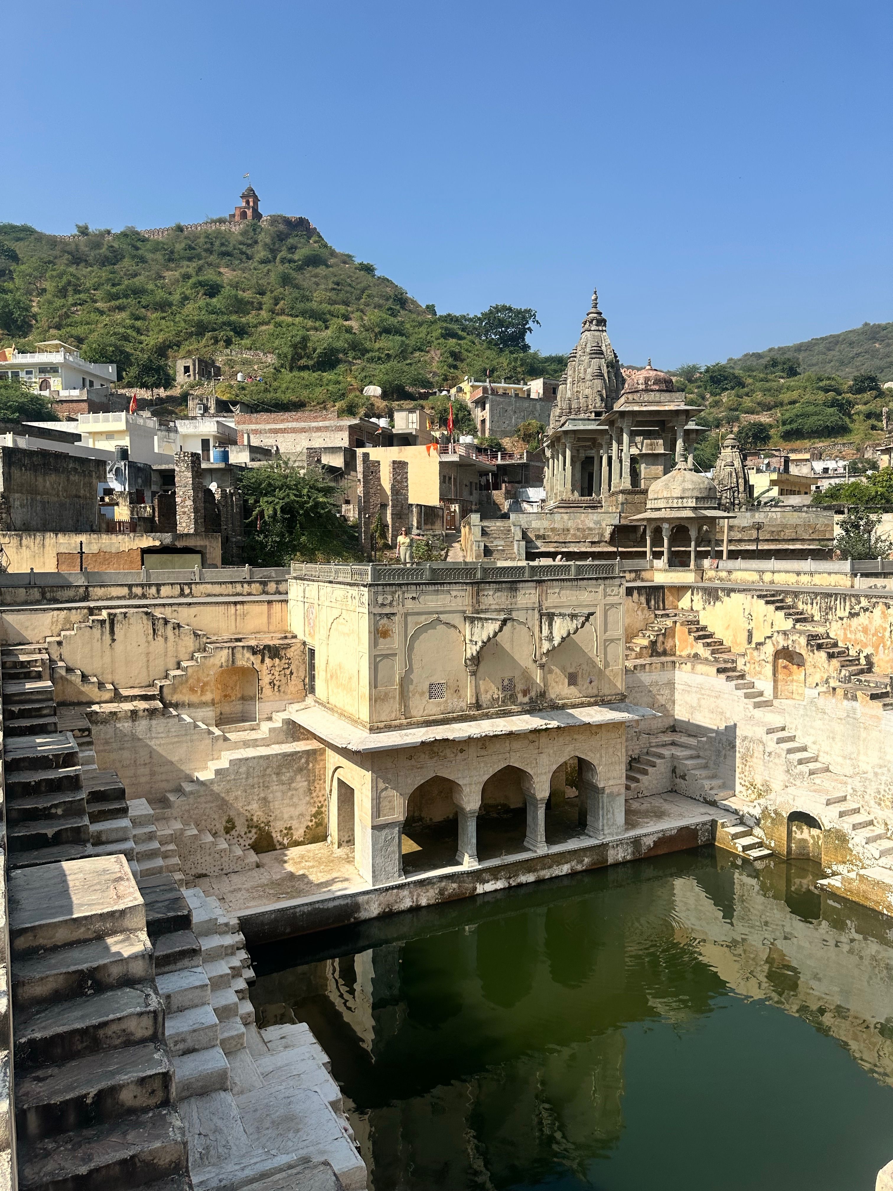 Ancient Stepwell and Temple in Indian Landscape · Free Stock Photo