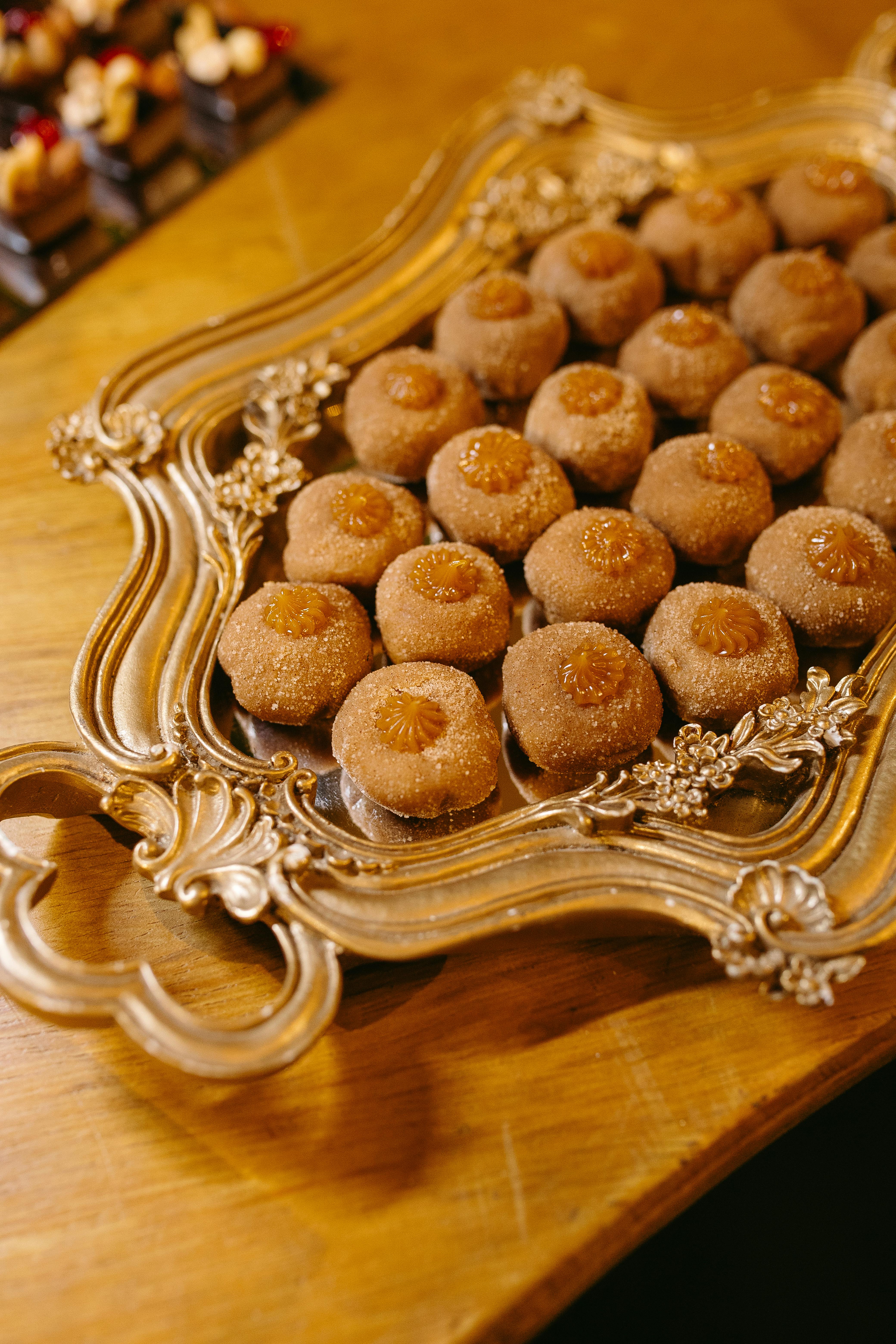 Assorted Brown Pastries on Ornate Silver Tray · Free Stock Photo