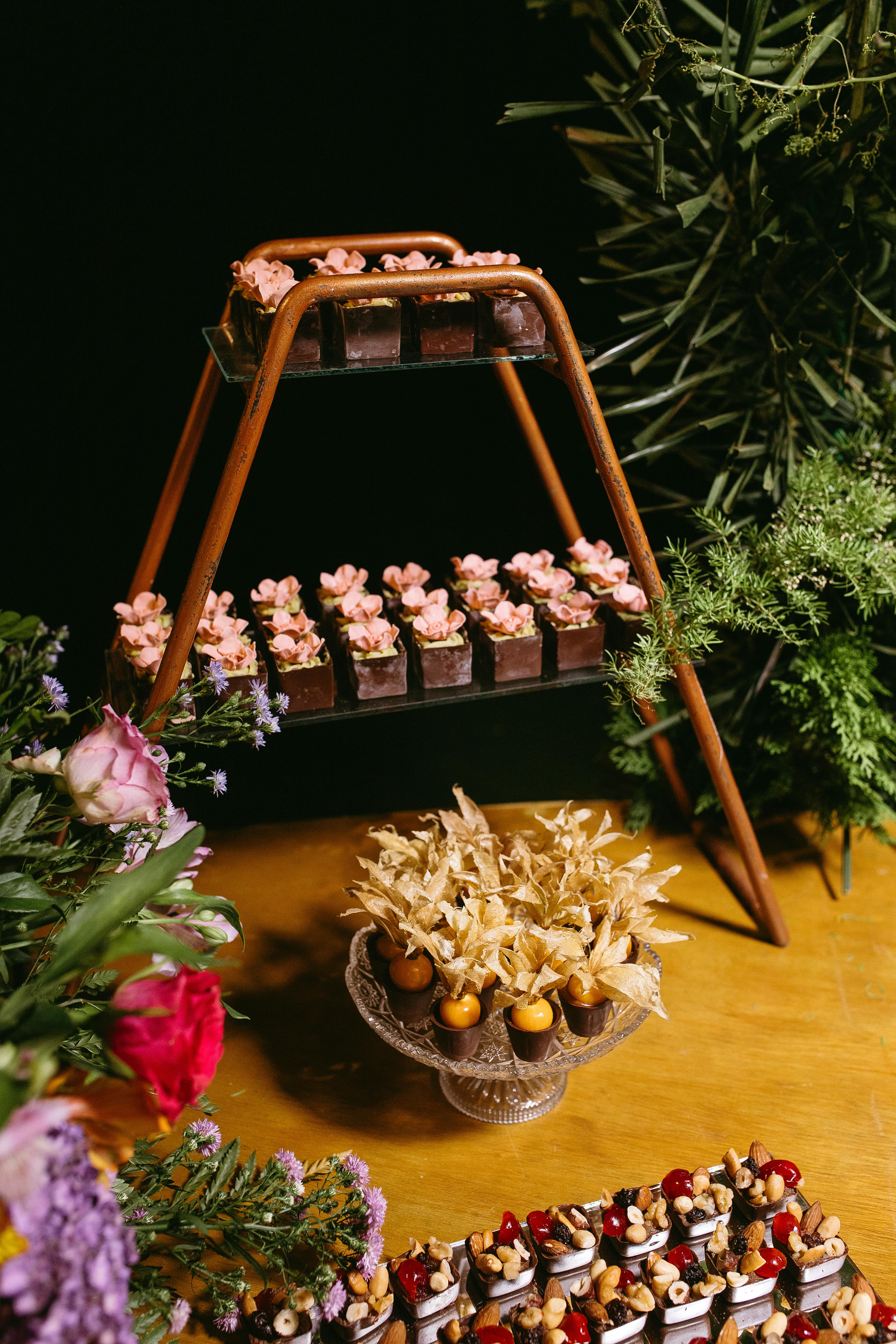 Elegant Dessert Table with Floral Arrangement · Free Stock Photo
