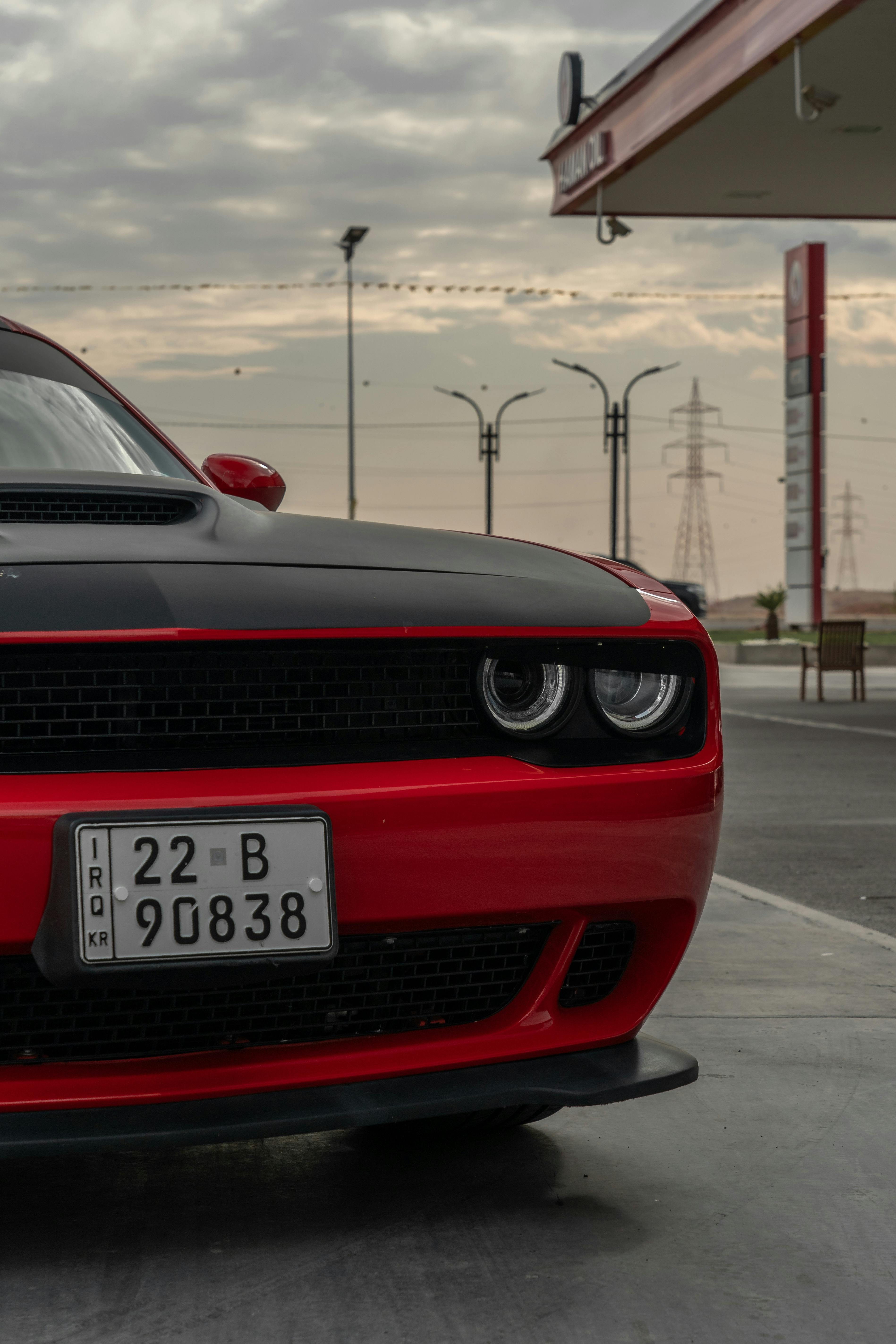 Dodge Challenger with Blue Headlights Reflecting in the Street Surface ...