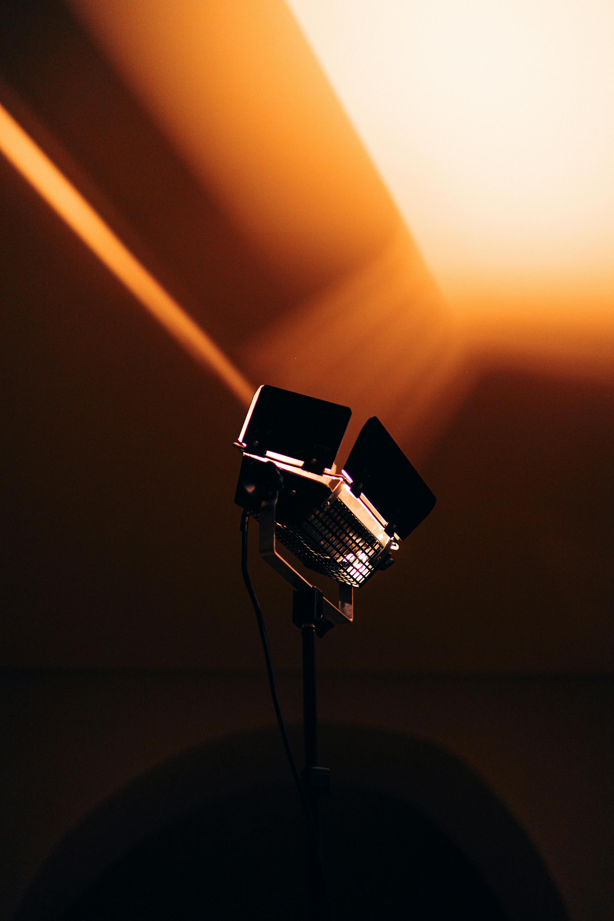 Red Chair on Spotlight Casting Shadow · Free Stock Photo