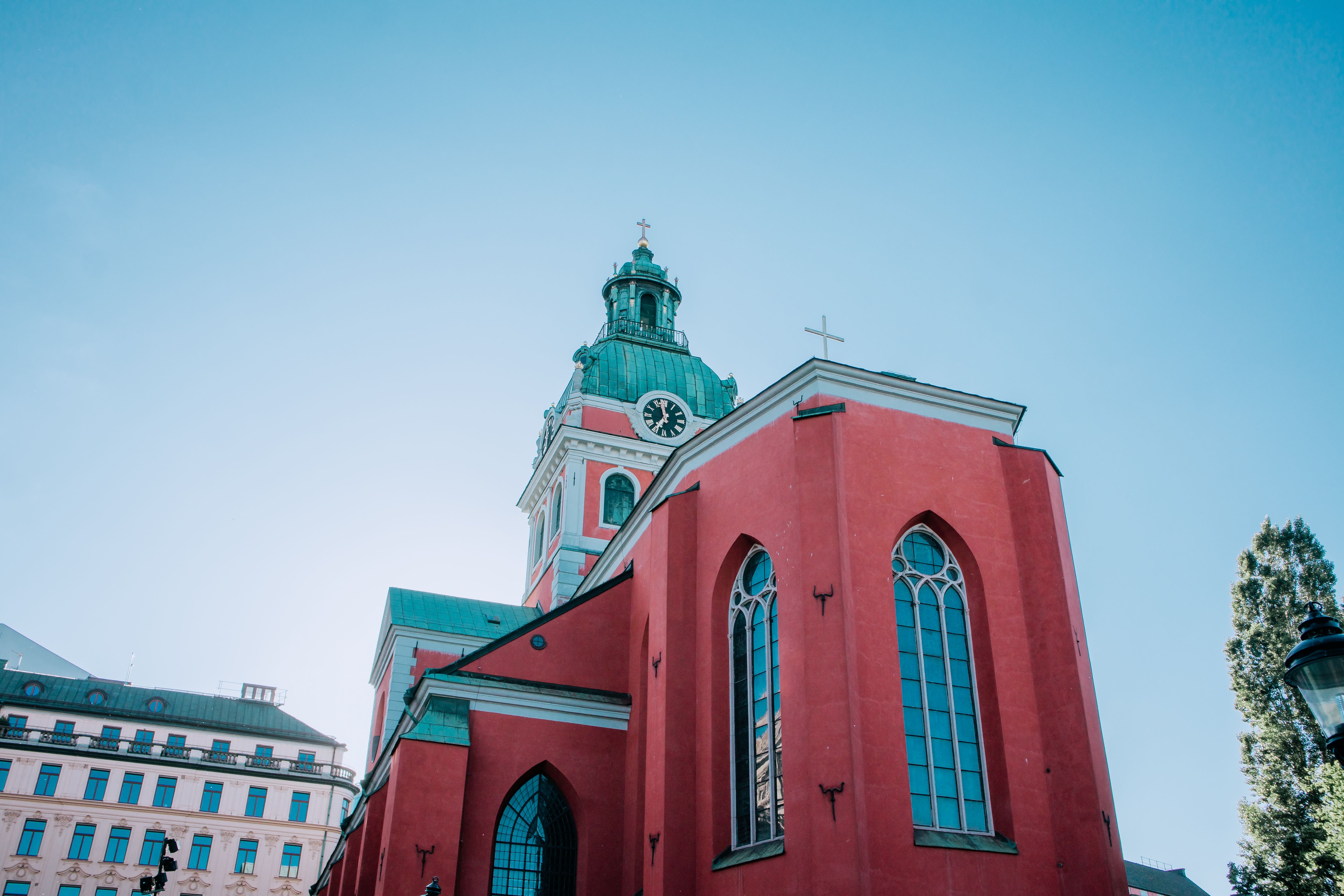 Beautiful Red Church Tower against Blue Sky · Free Stock Photo