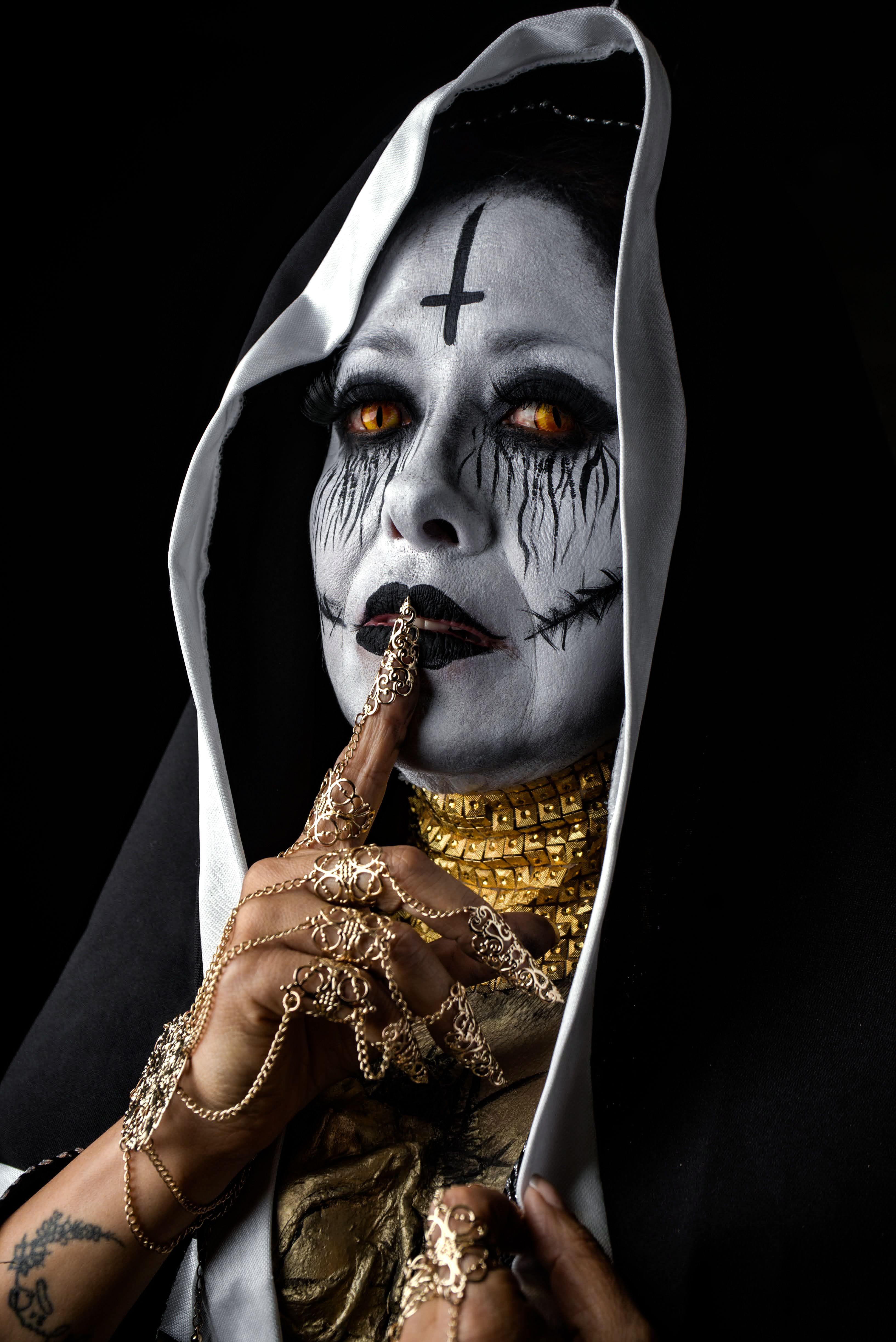 Dramatic Gothic Nun with Intricate Jewelry · Free Stock Photo