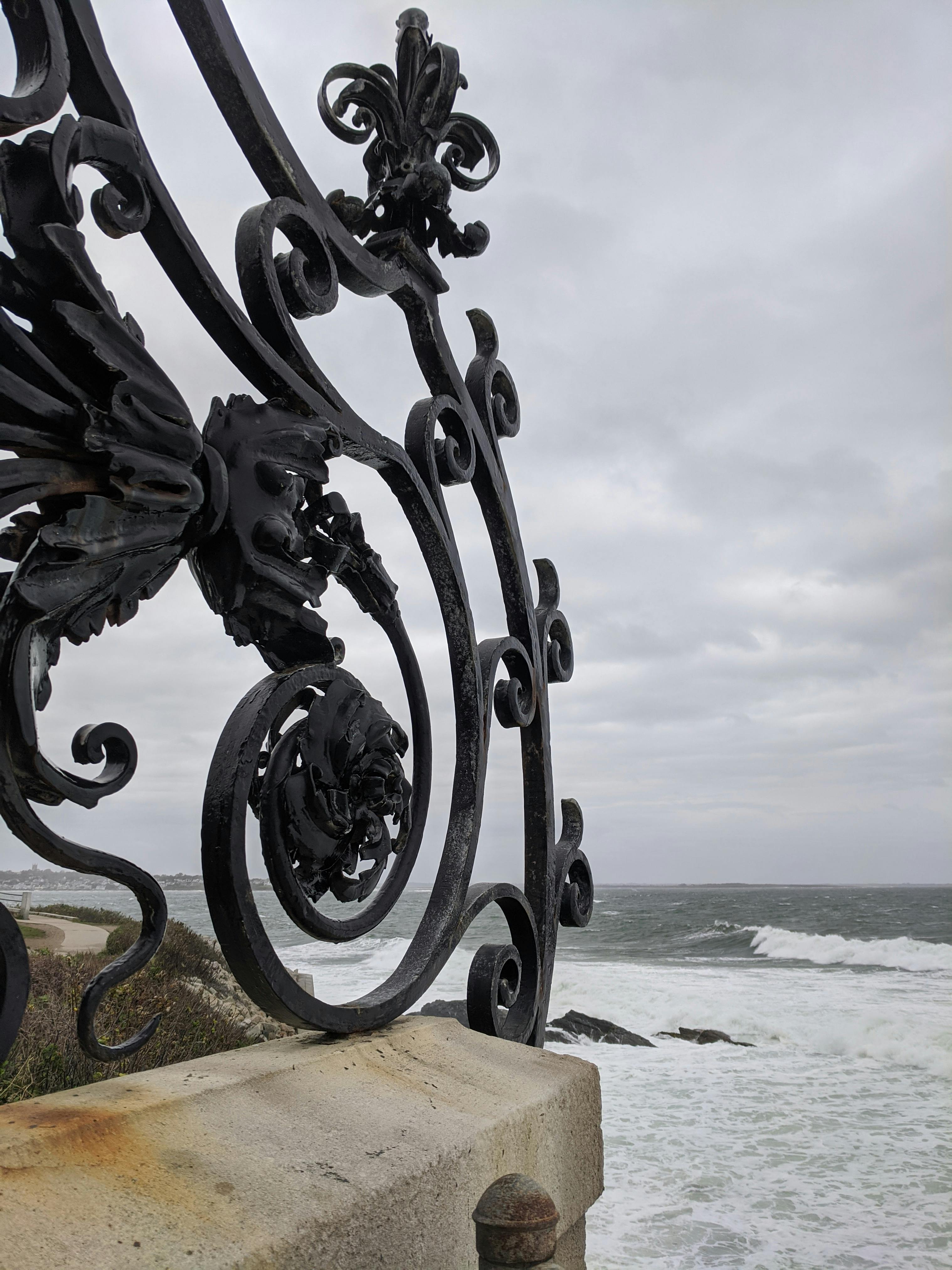 Ornate Railing Overlooking Stormy Ocean · Free Stock Photo