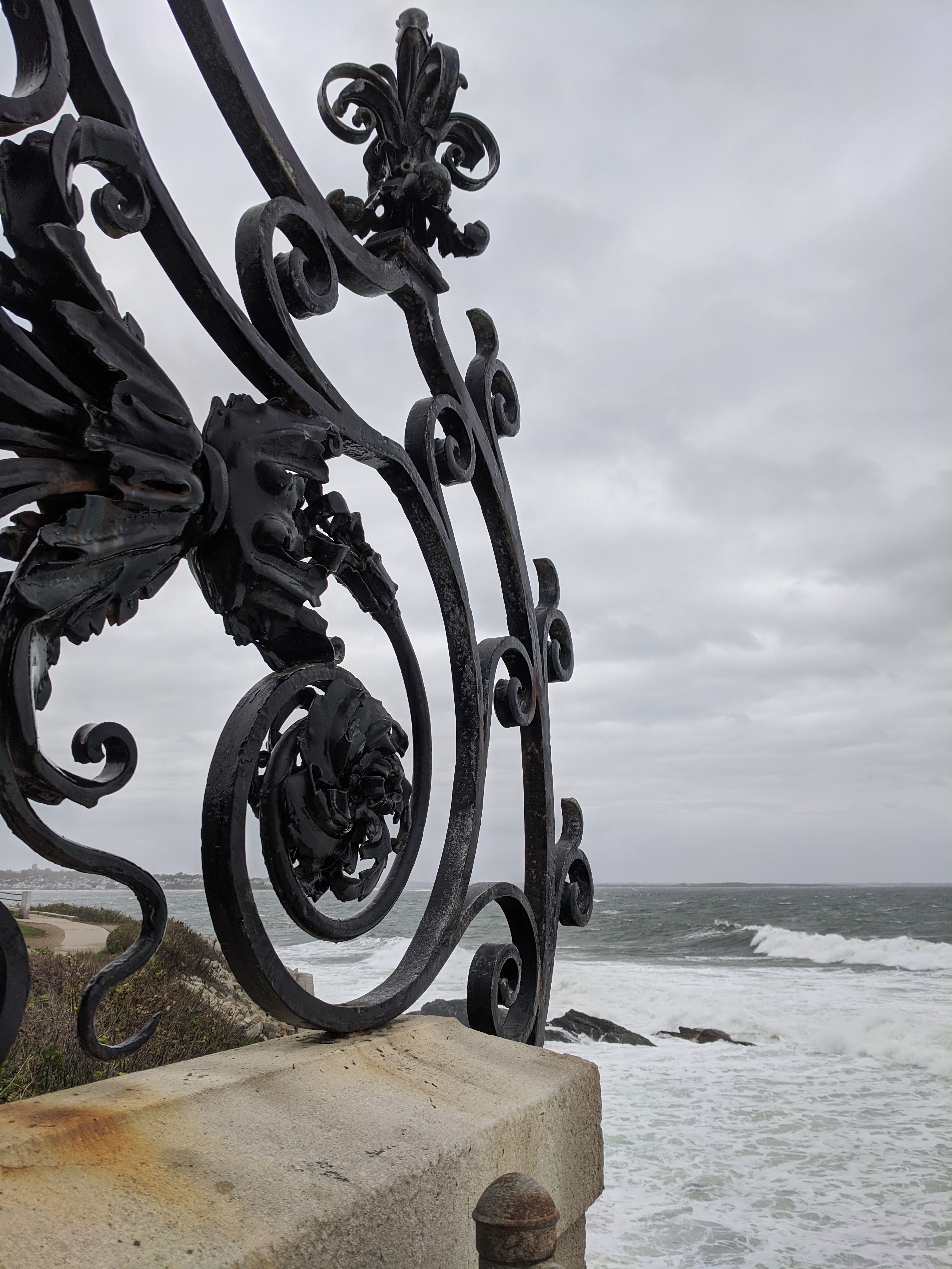Ornate Railing Overlooking Stormy Ocean · Free Stock Photo