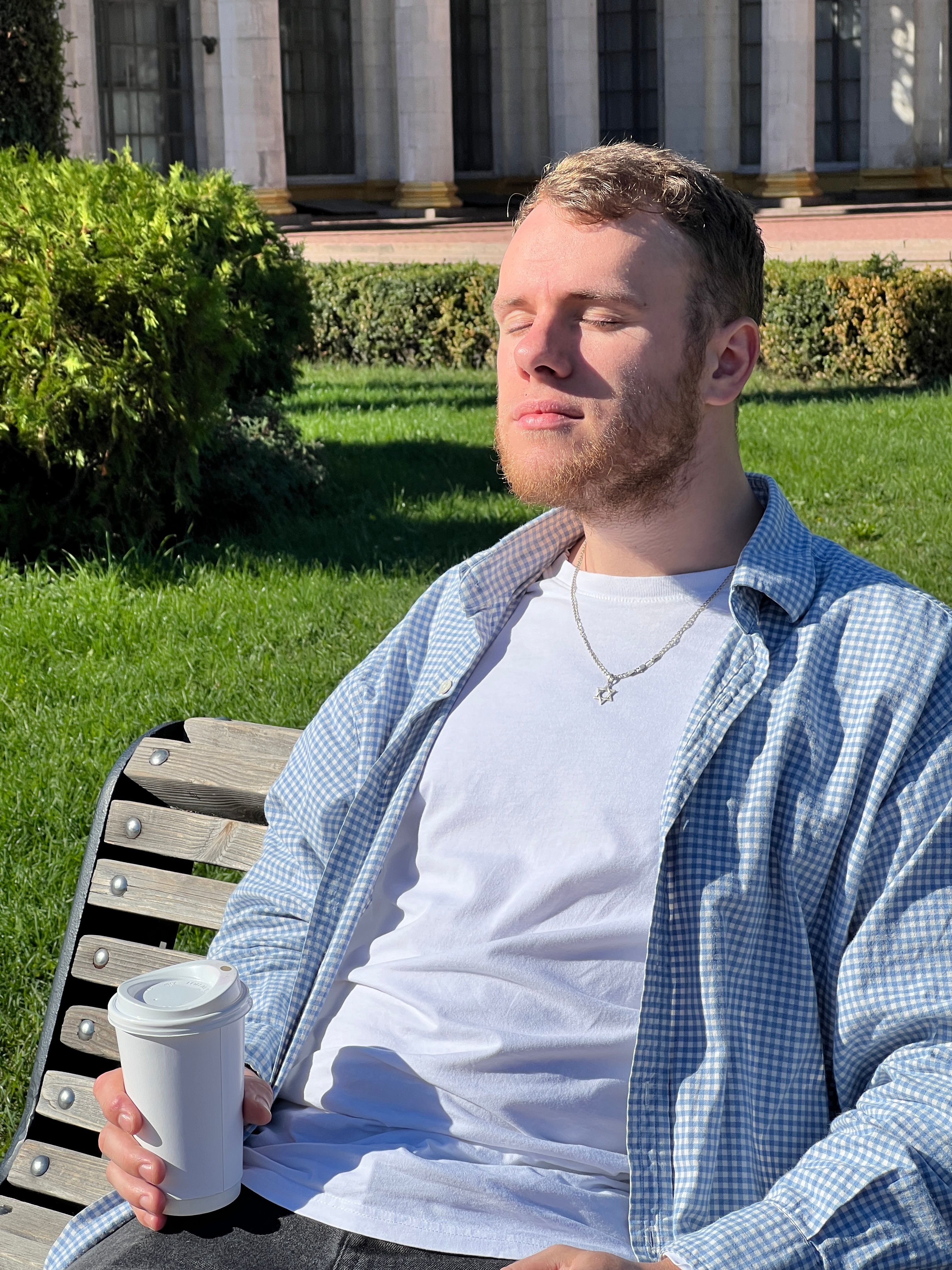 Relaxed Man Enjoying Sunshine in Park · Free Stock Photo