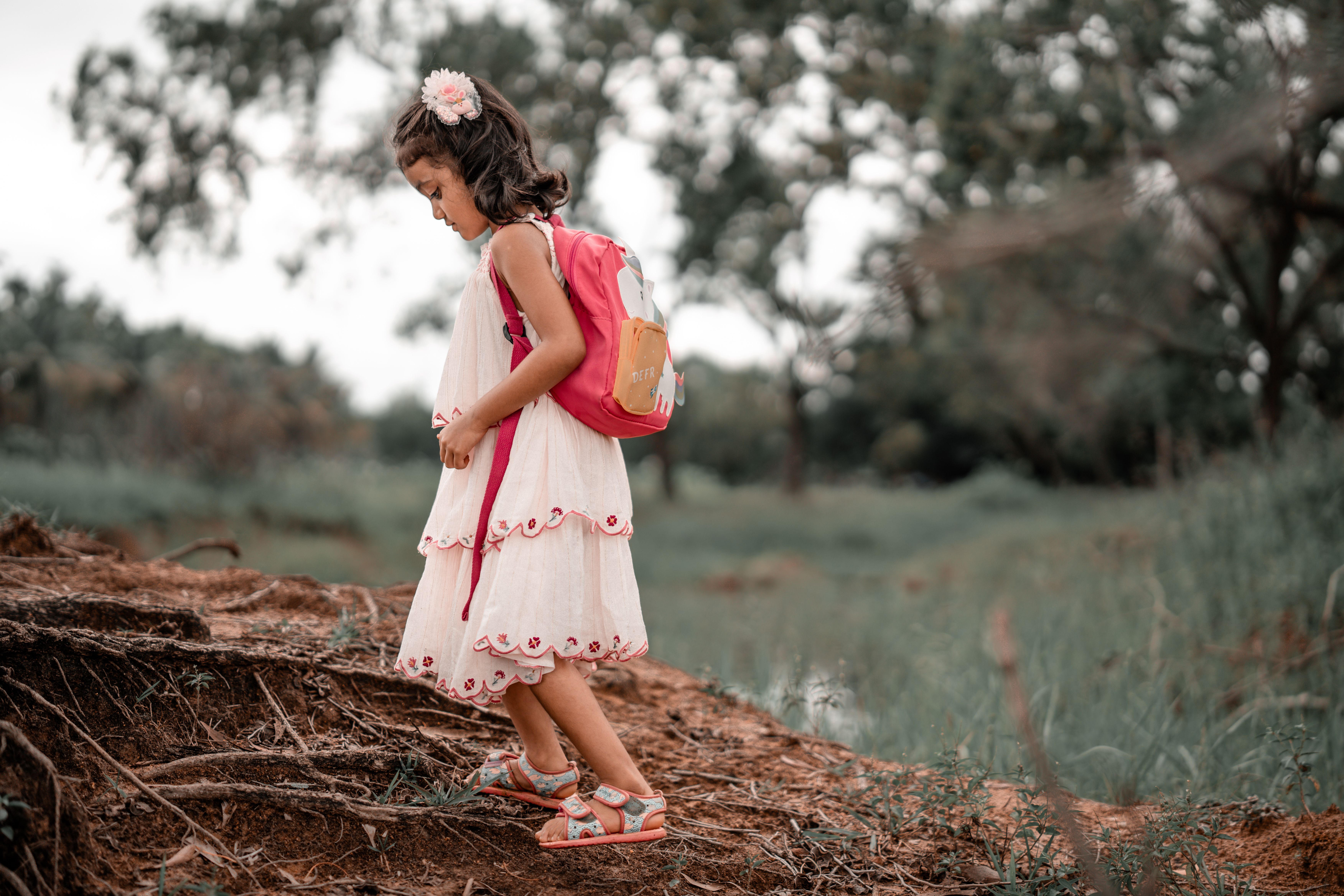 Young Girl Exploring Nature with Backpack · Free Stock Photo