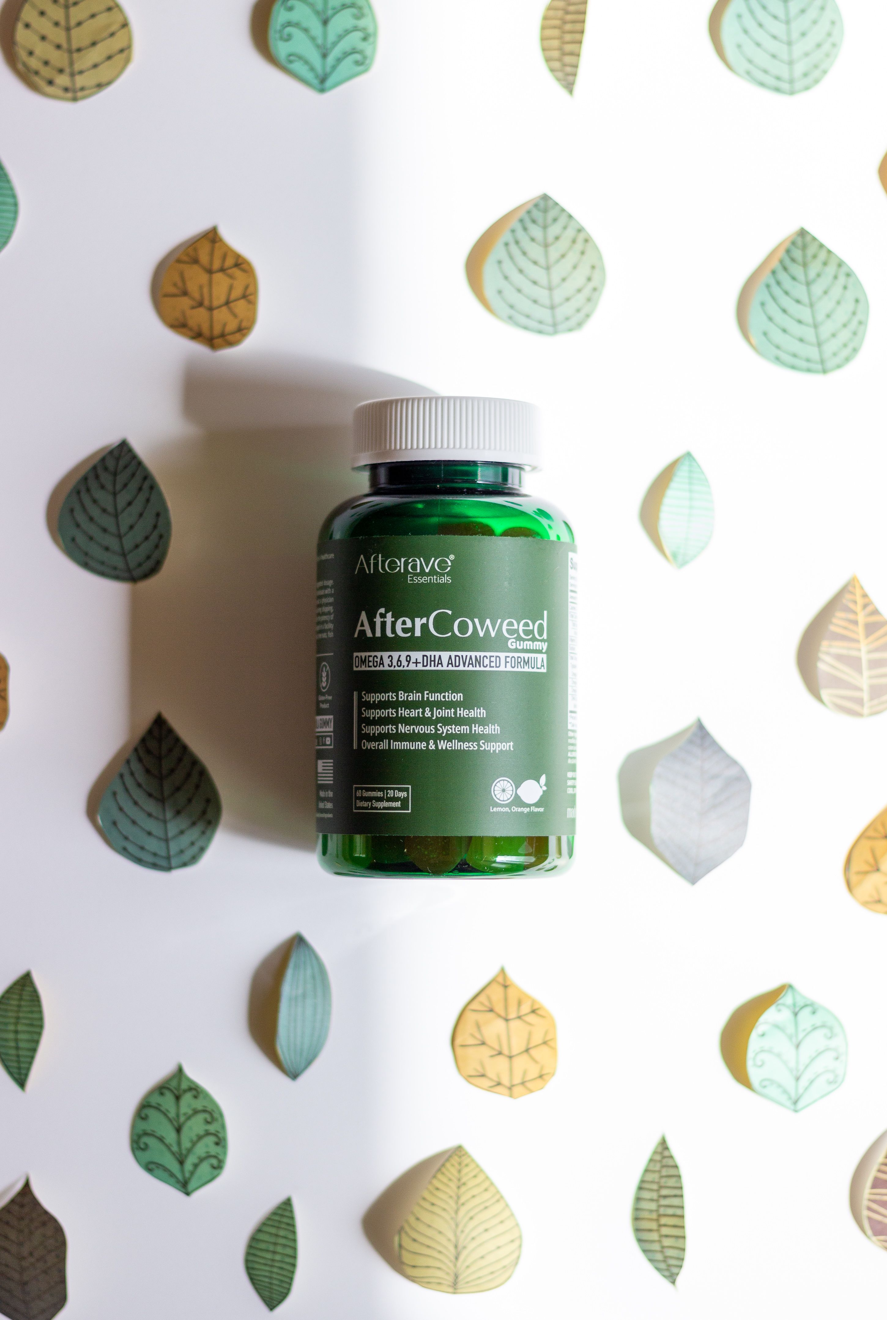 Herbal Supplement Bottle with Leaf Patterns · Free Stock Photo