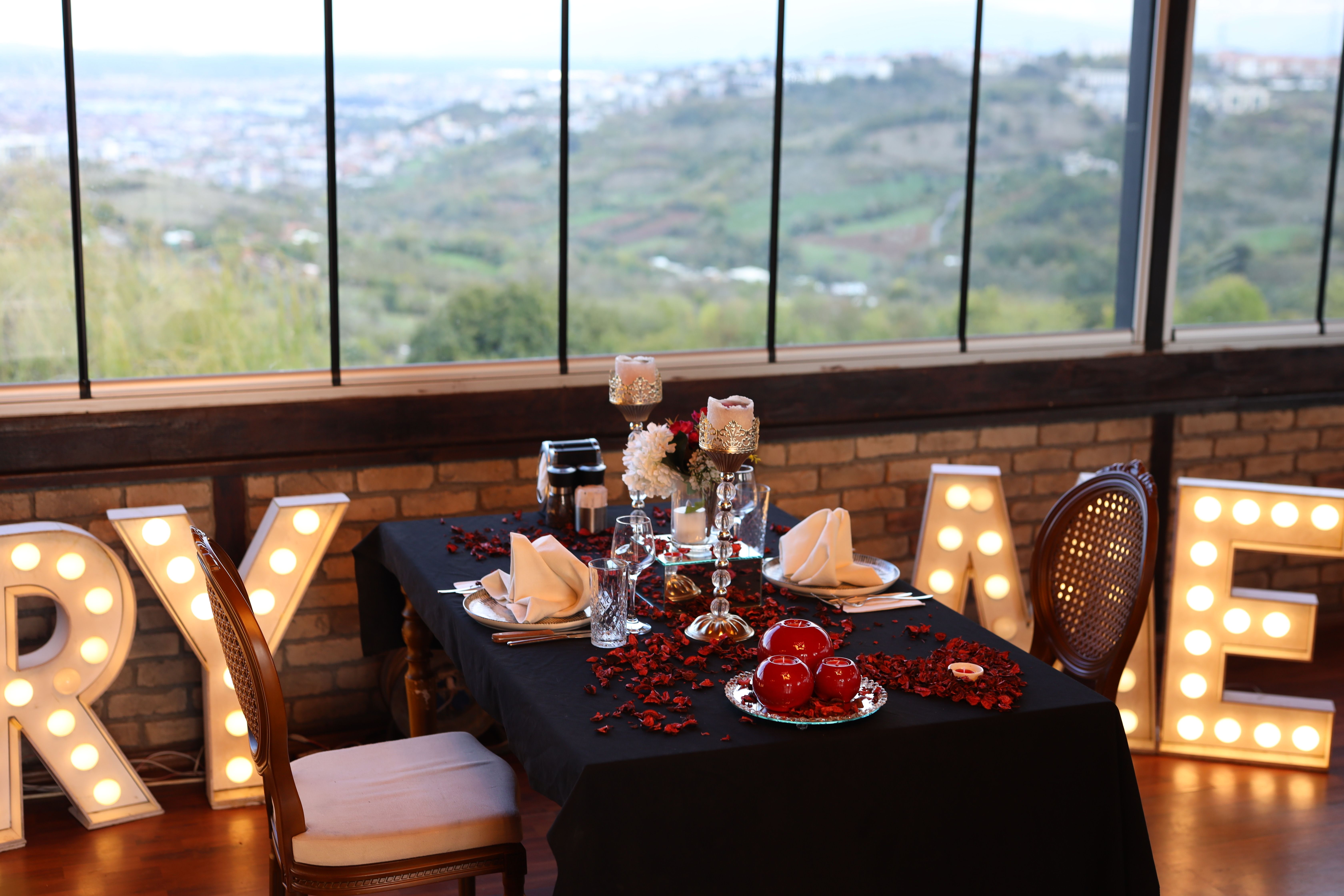 Romantic Dinner Setting with Scenic View · Free Stock Photo