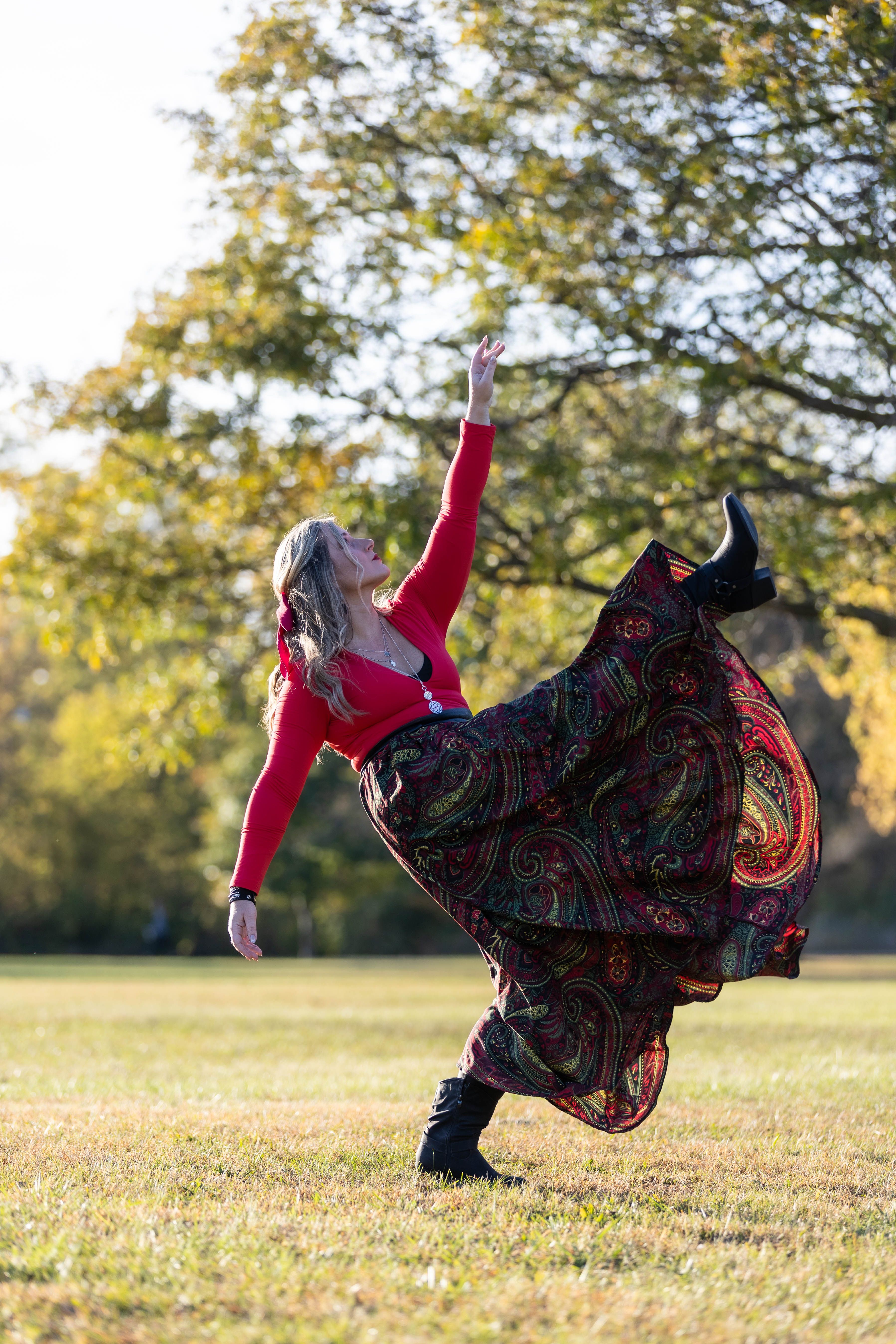 Woman Dancing Joyfully in Autumn Field · Free Stock Photo