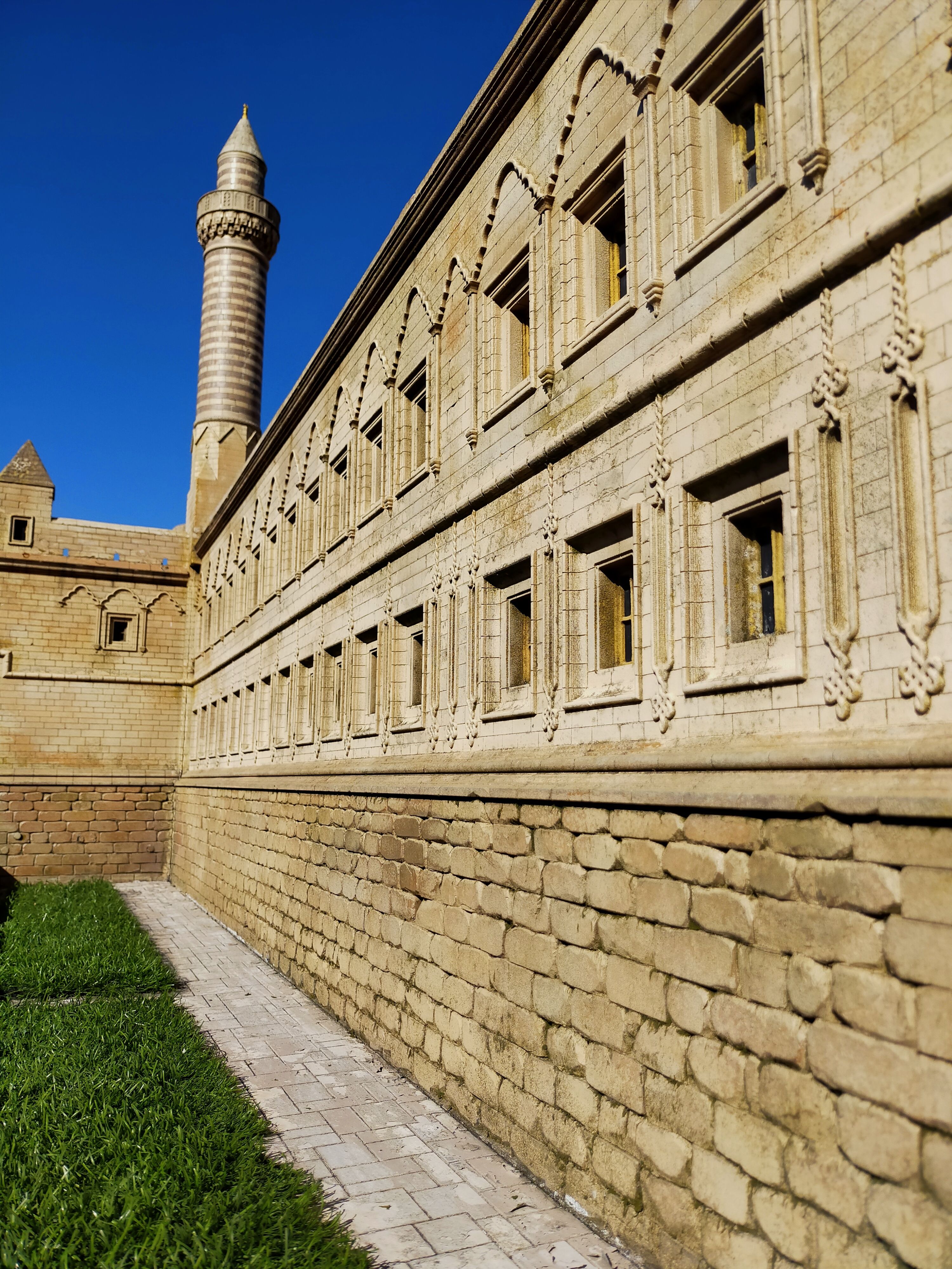 Historic Stone Architecture with Tower and Arches · Free Stock Photo