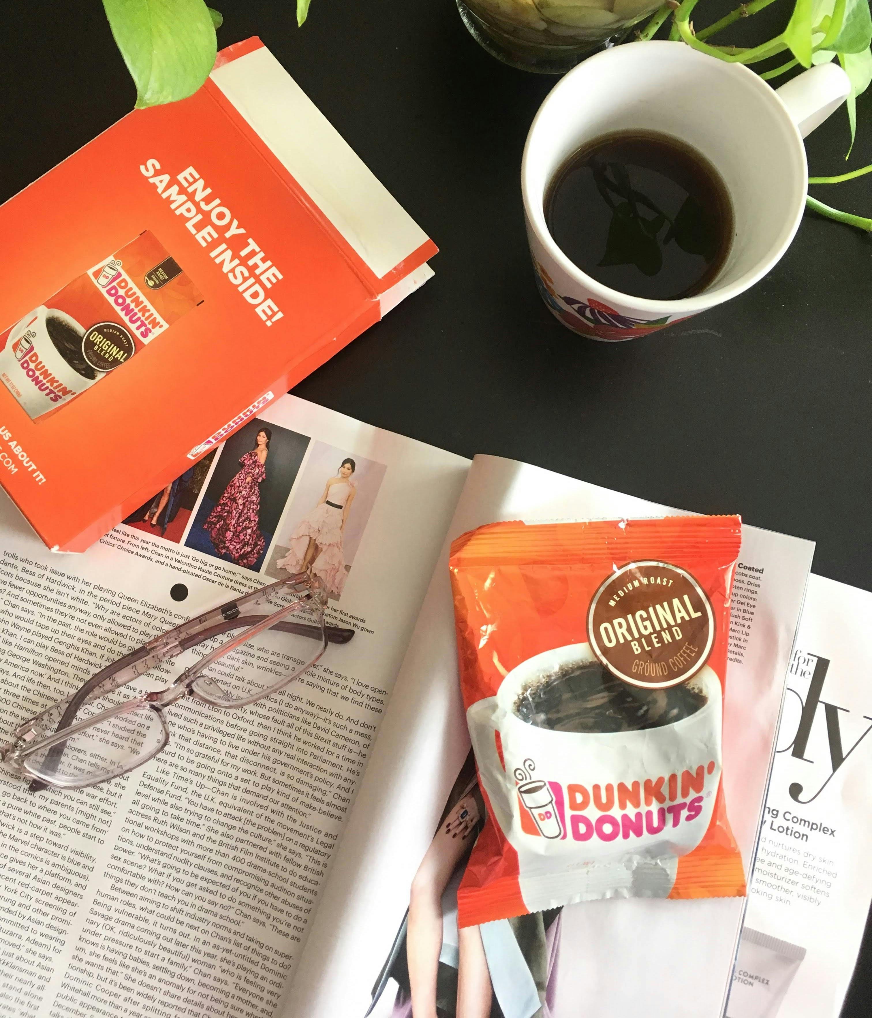 Morning Coffee and Reading Setup with Dunkin' · Free Stock Photo