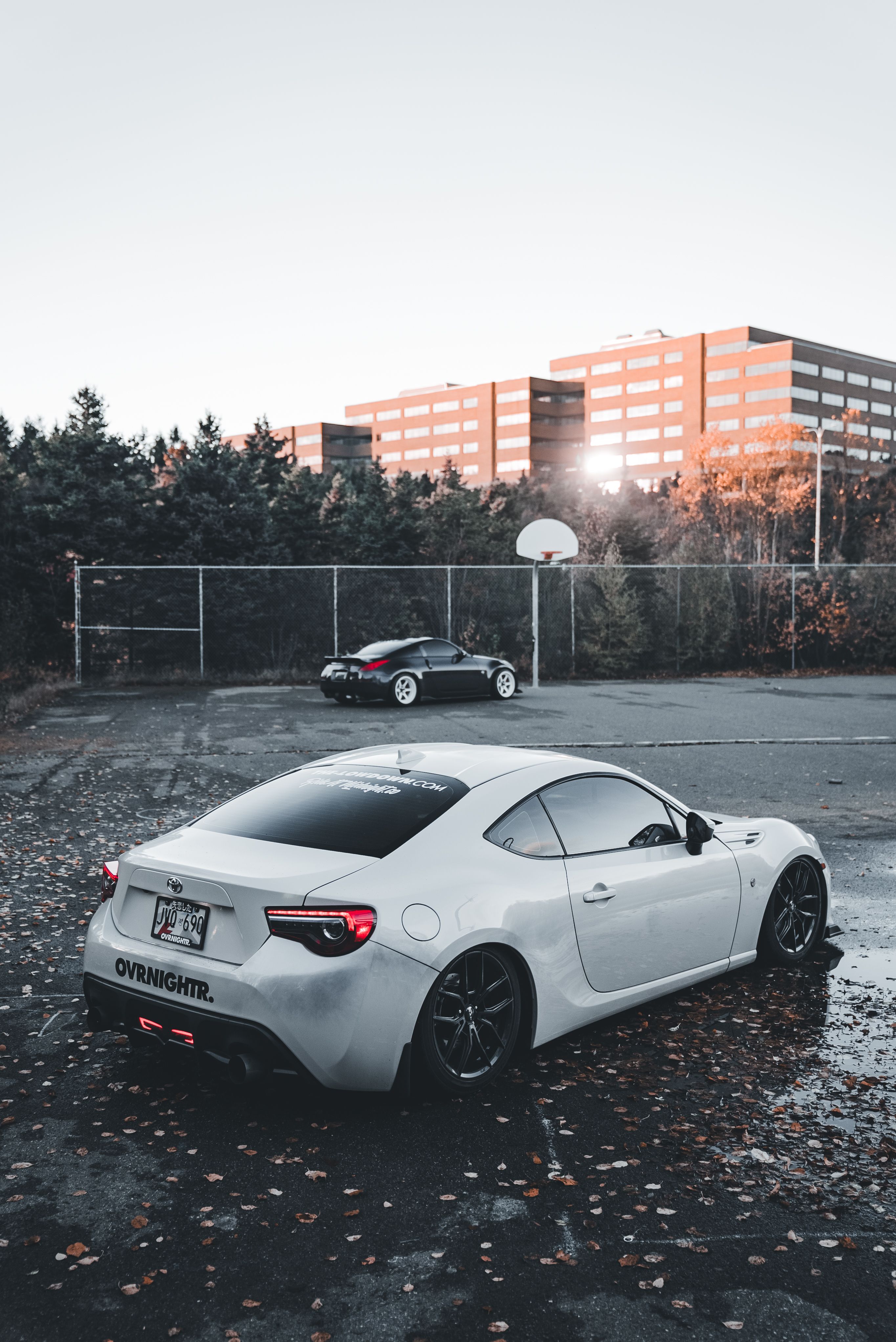Sports Cars in Urban Autumn Basketball Court · Free Stock Photo
