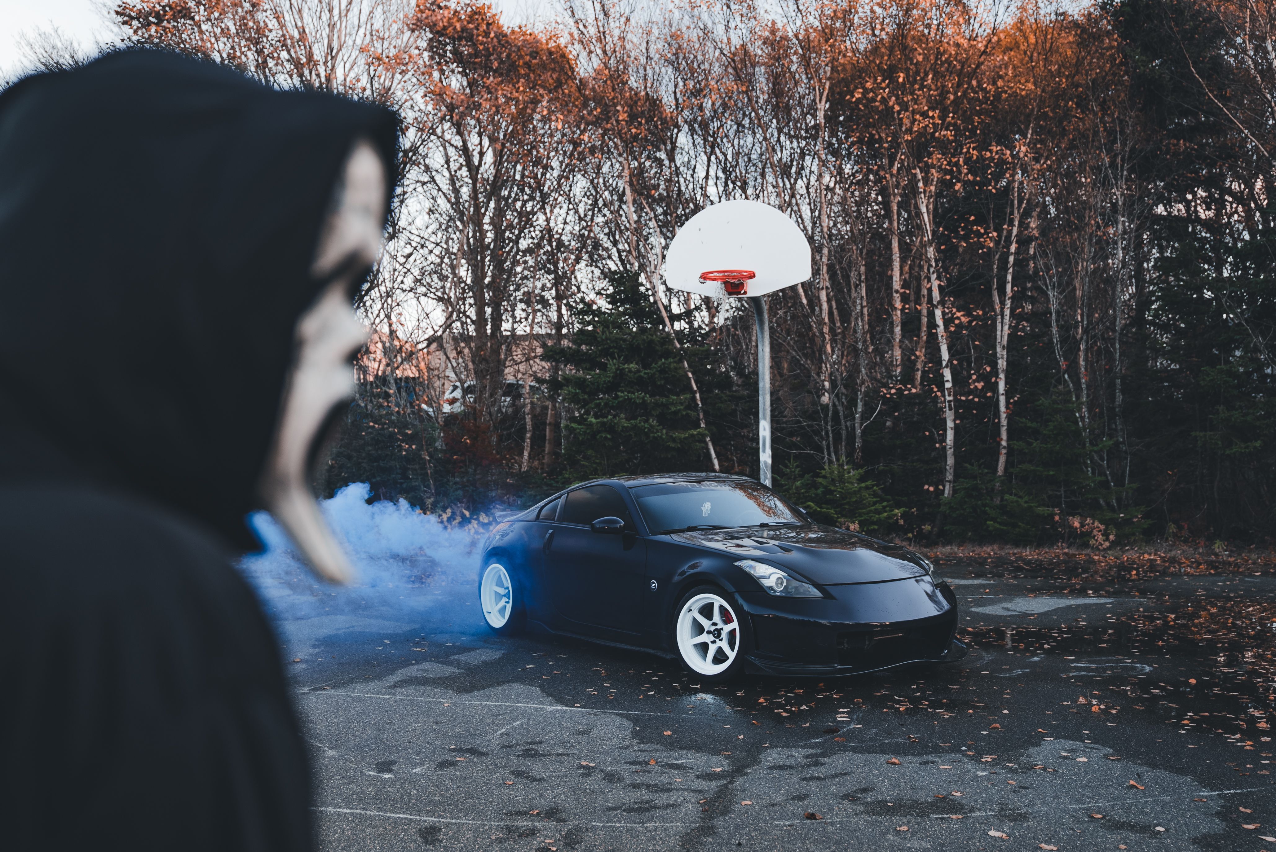 Halloween Mask and Sports Car on Autumn Court · Free Stock Photo