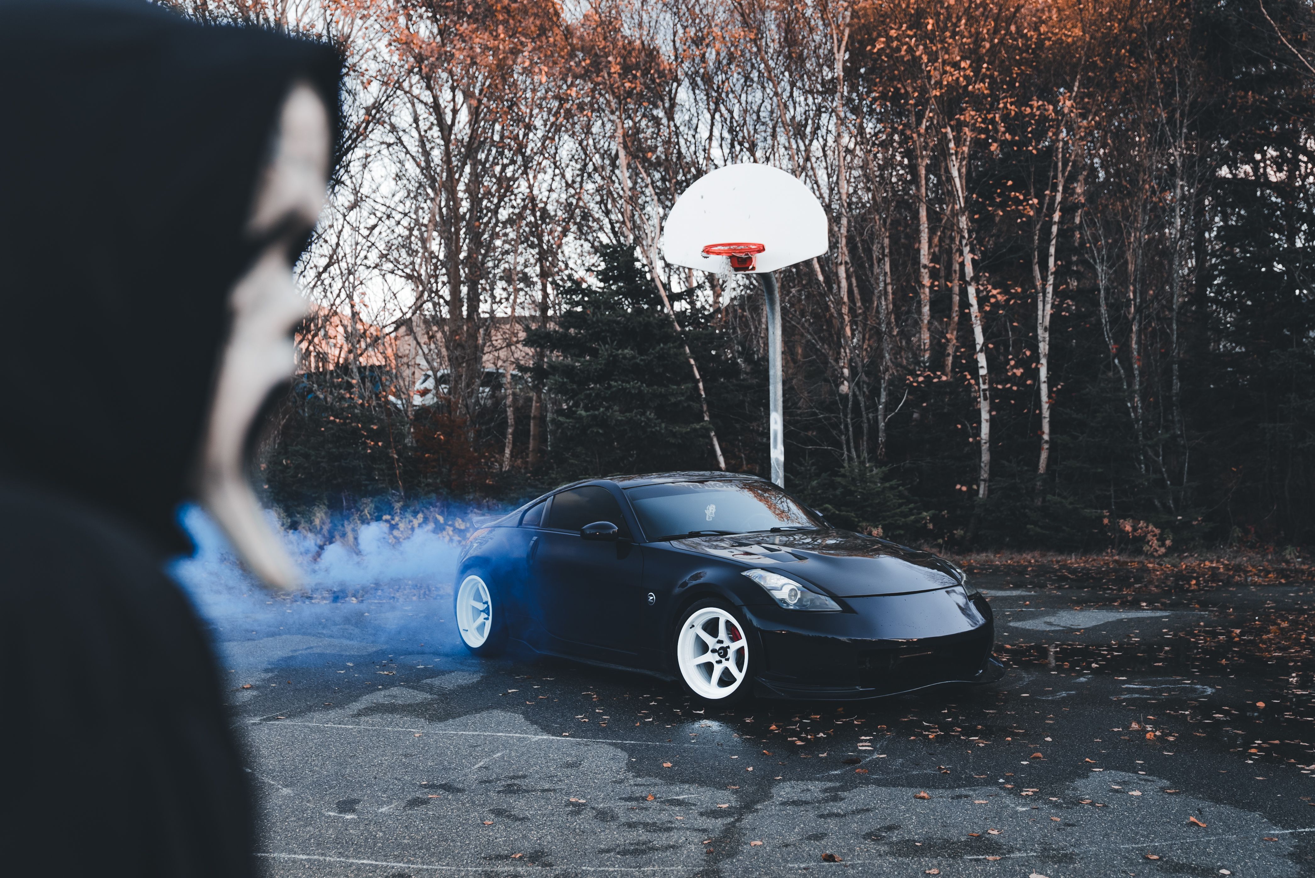 Sporty Car with Smoke on Outdoor Basketball Court · Free Stock Photo