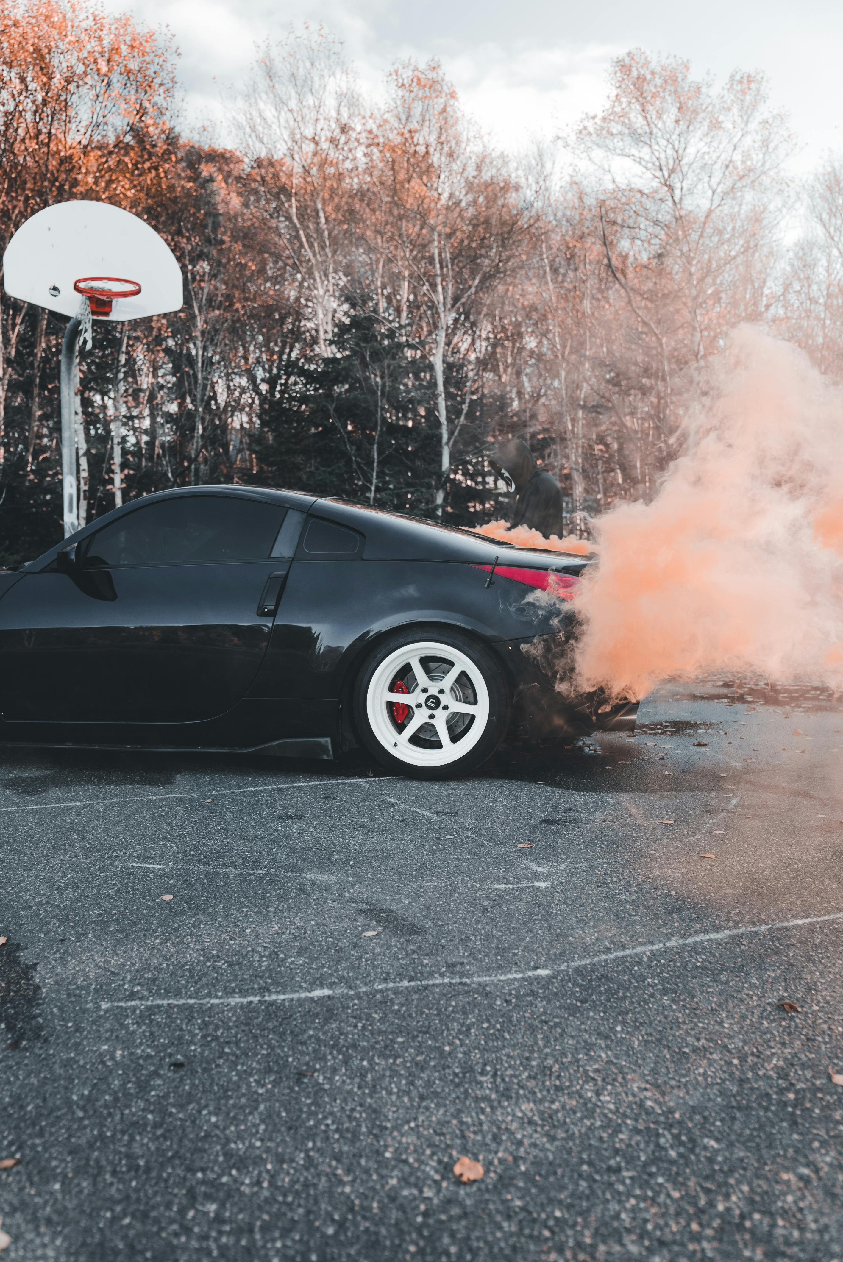 Sportscar Drifting with Dramatic Smoke Effect · Free Stock Photo