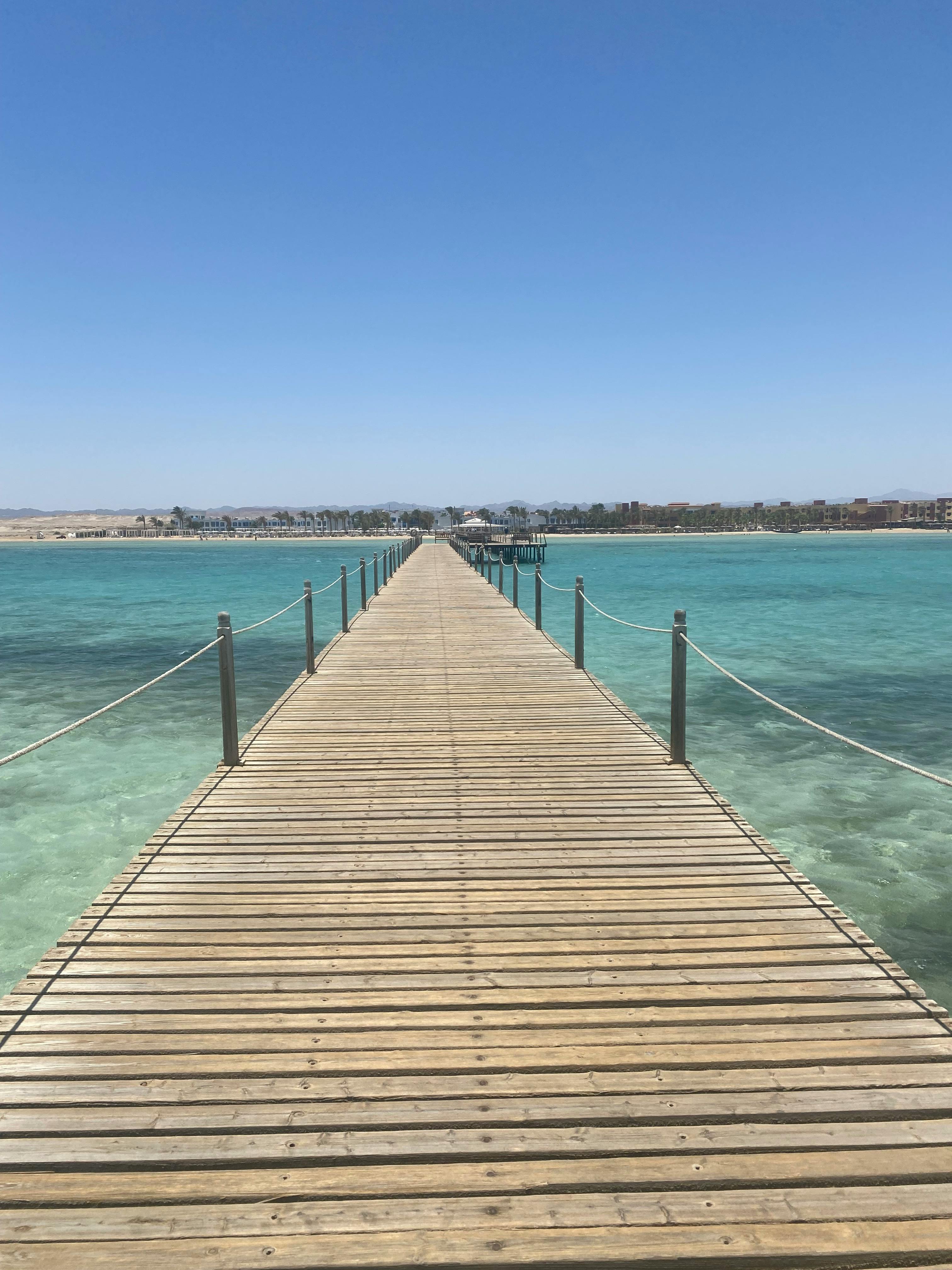 Scenic Pier Over Turquoise Waters in Marsa Alam · Free Stock Photo