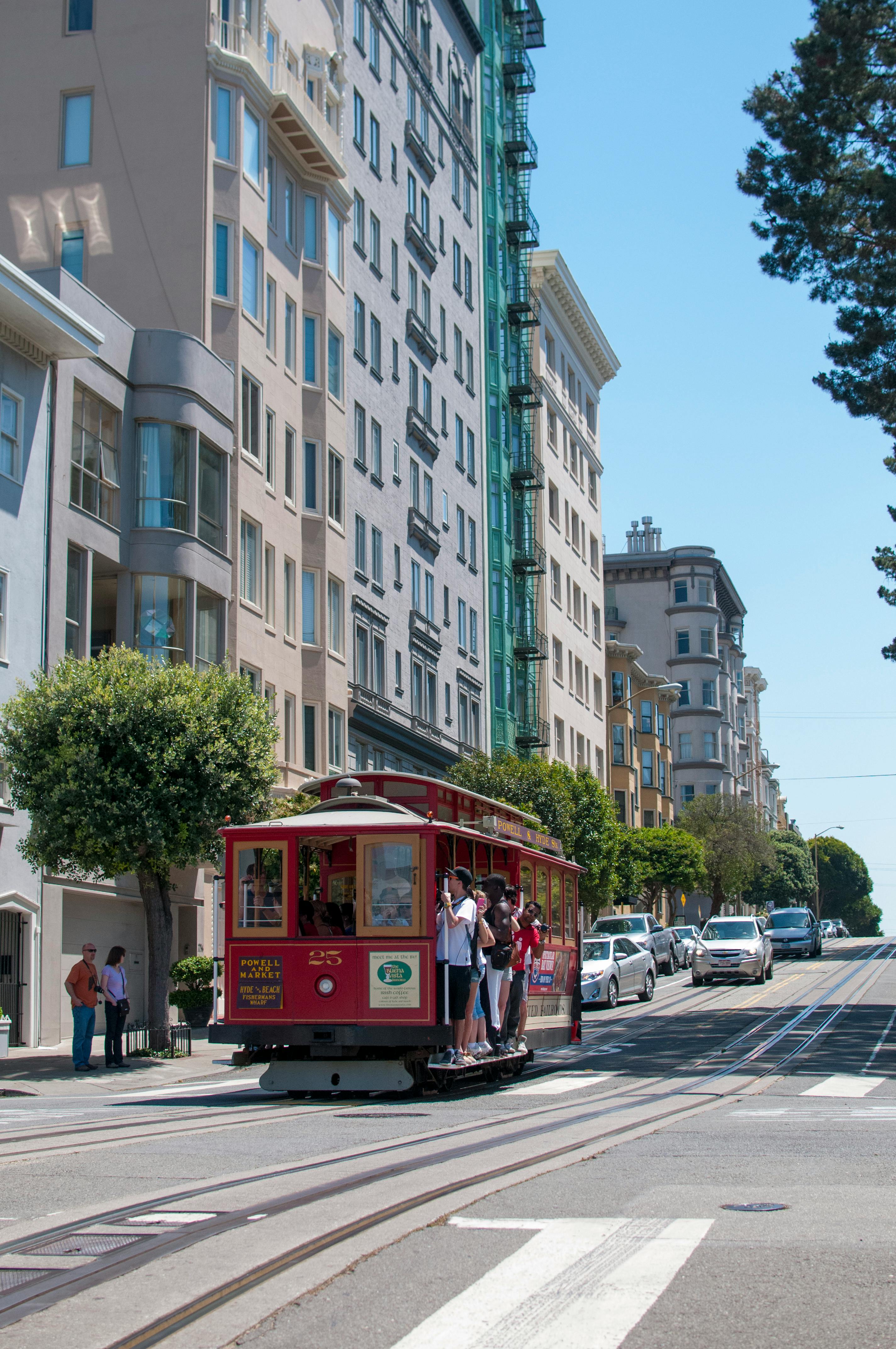 Iconic San Francisco Cable Car in Urban Street · Free Stock Photo
