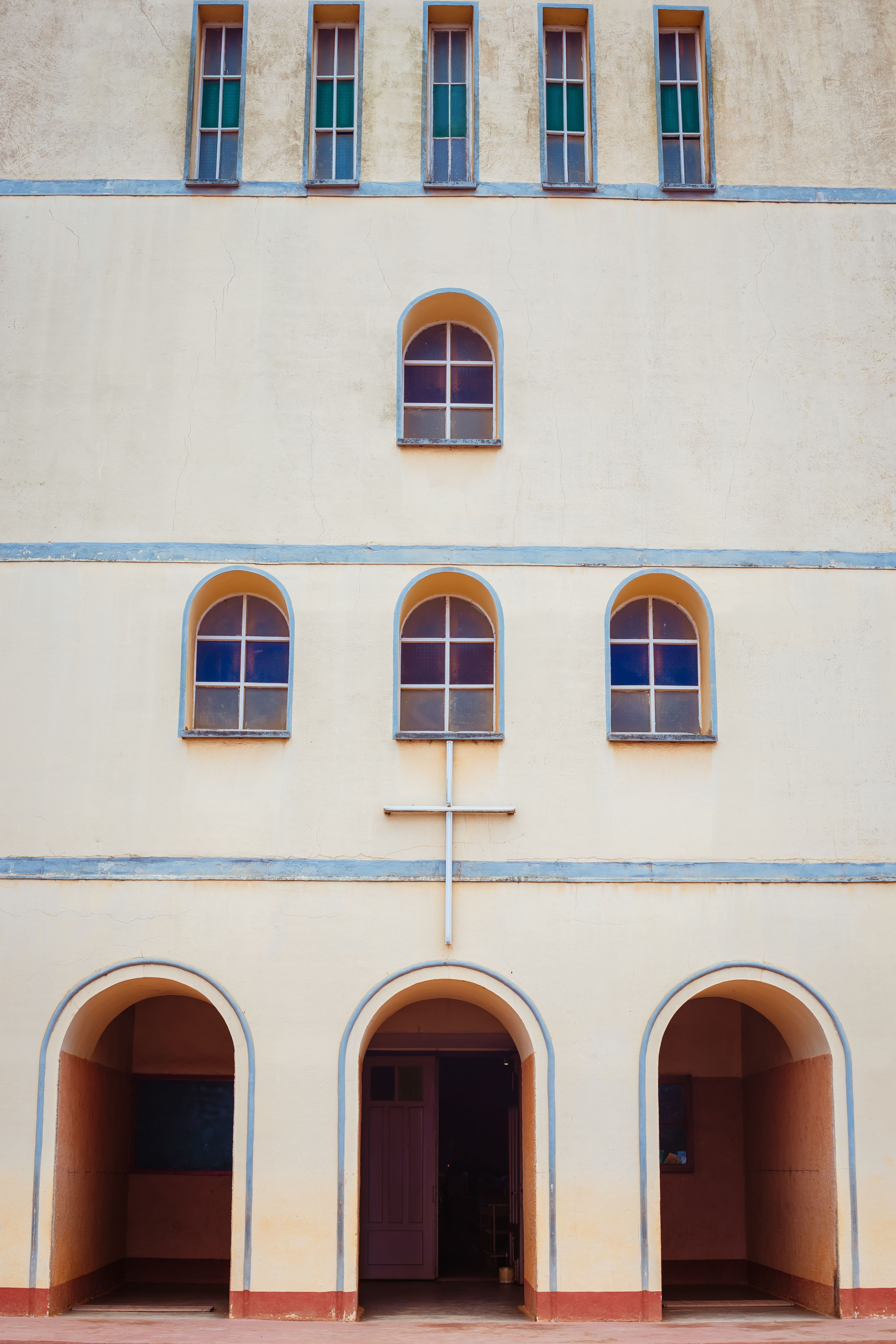 Classic Church Façade with Arched Windows and Entrance · Free Stock Photo