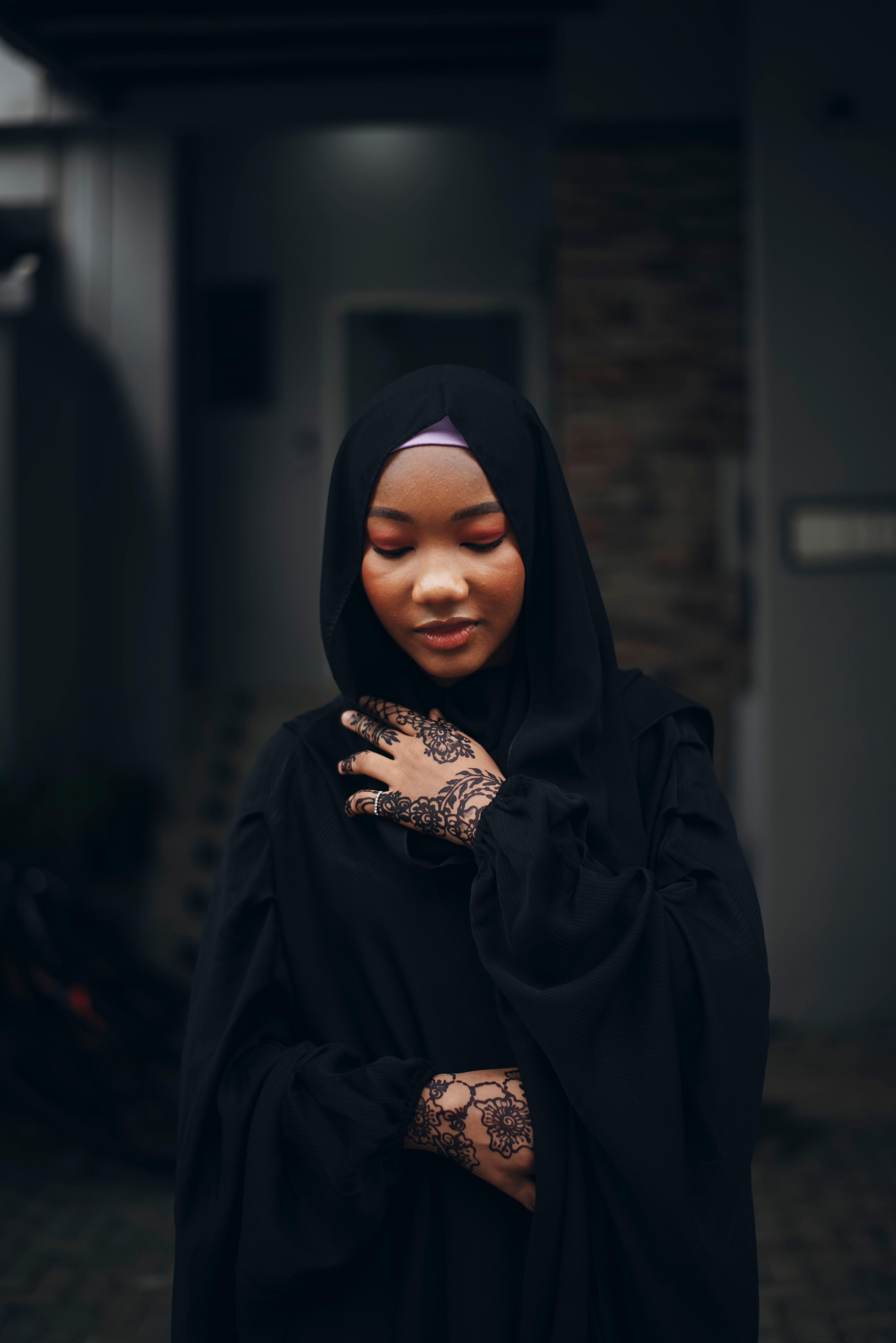 Elegant Portrait of Woman in Black Hijab with Henna · Free Stock Photo