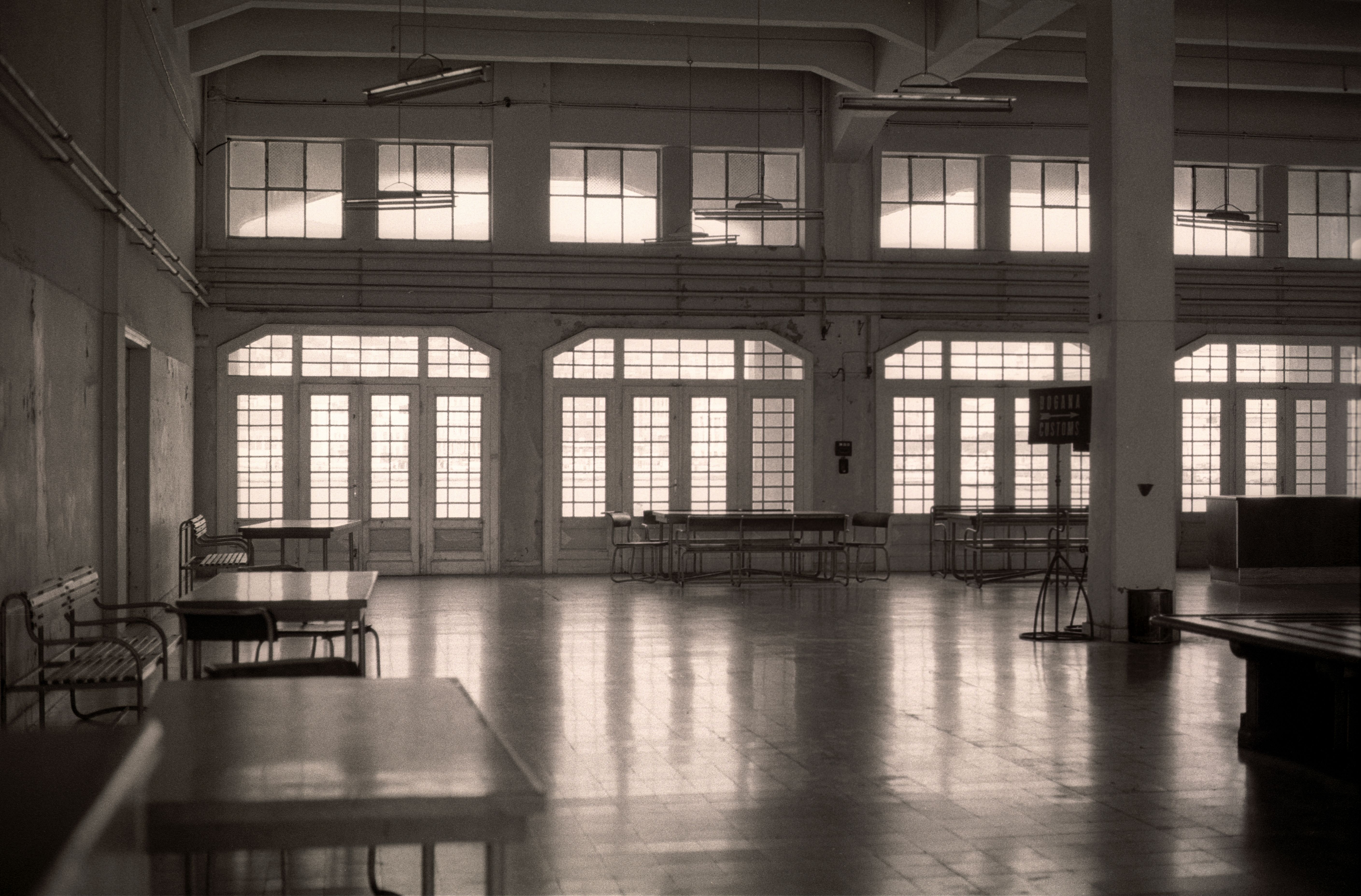 Vintage Industrial Interior with Large Windows · Free Stock Photo