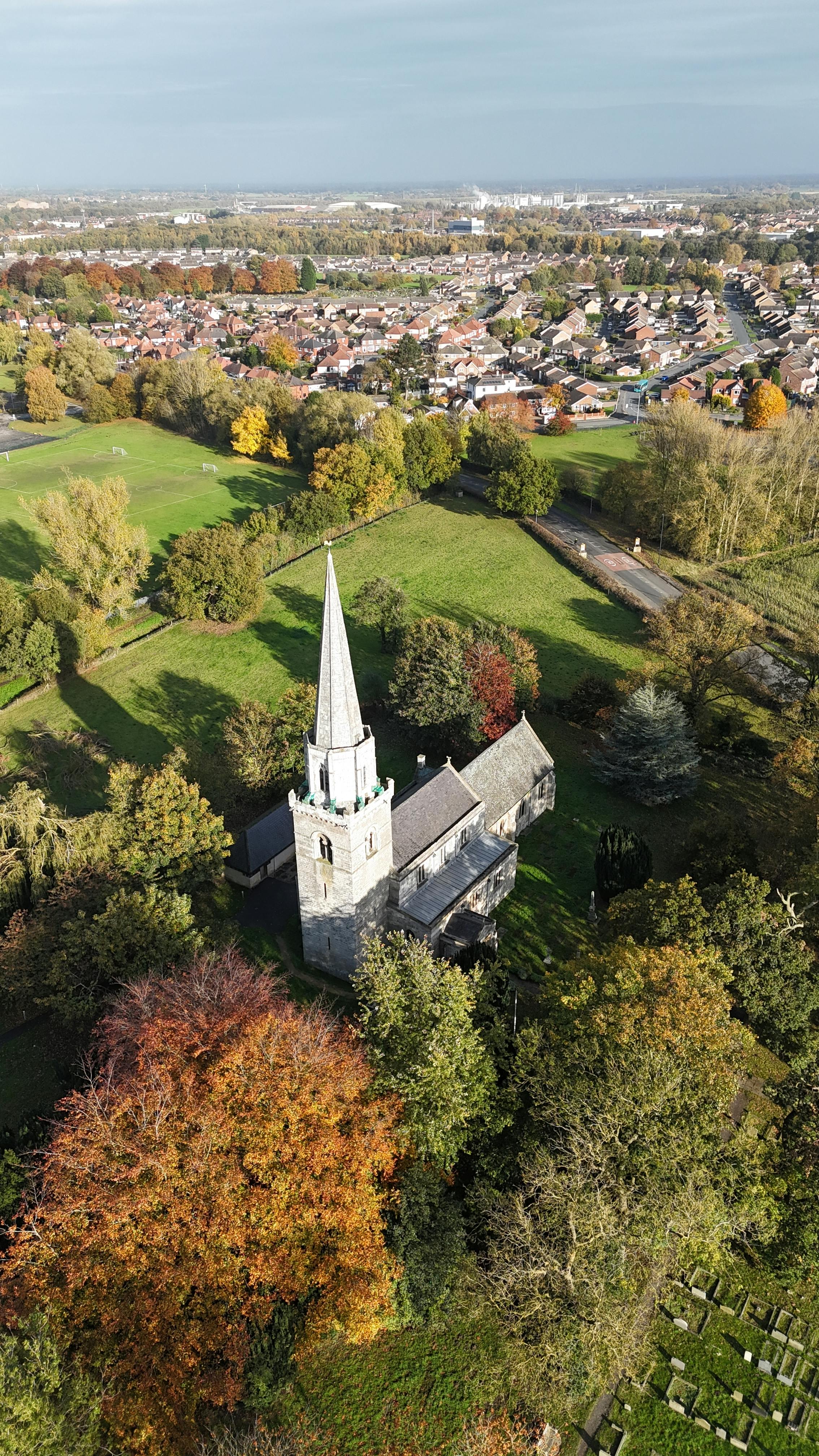 Aerial View of Church Surrounded by Autumn Foliage · Free Stock Photo