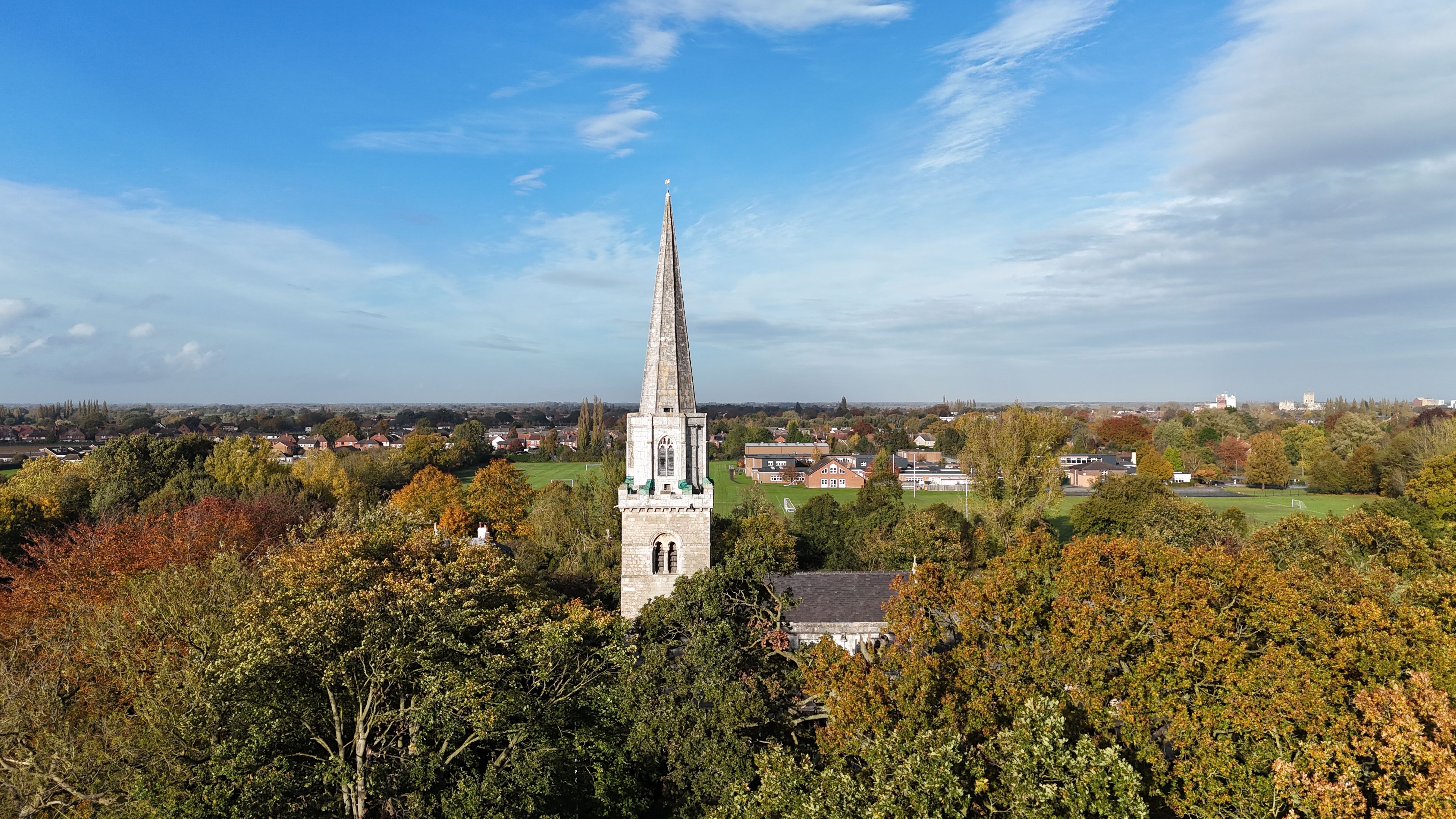 Aerial View of Church Spire in Autumn Landscape · Free Stock Photo