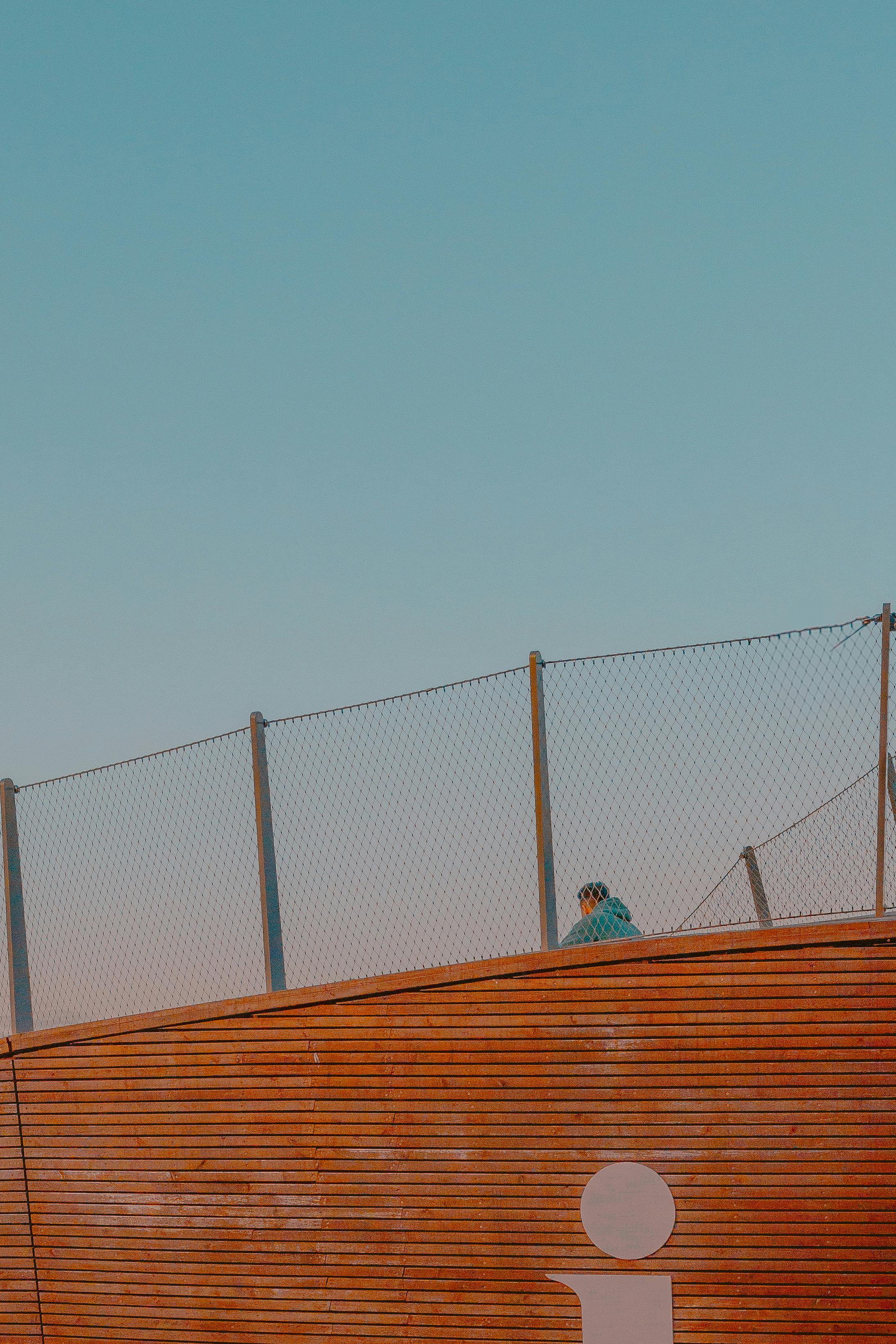 Modern Urban Fence under Clear Sky · Free Stock Photo
