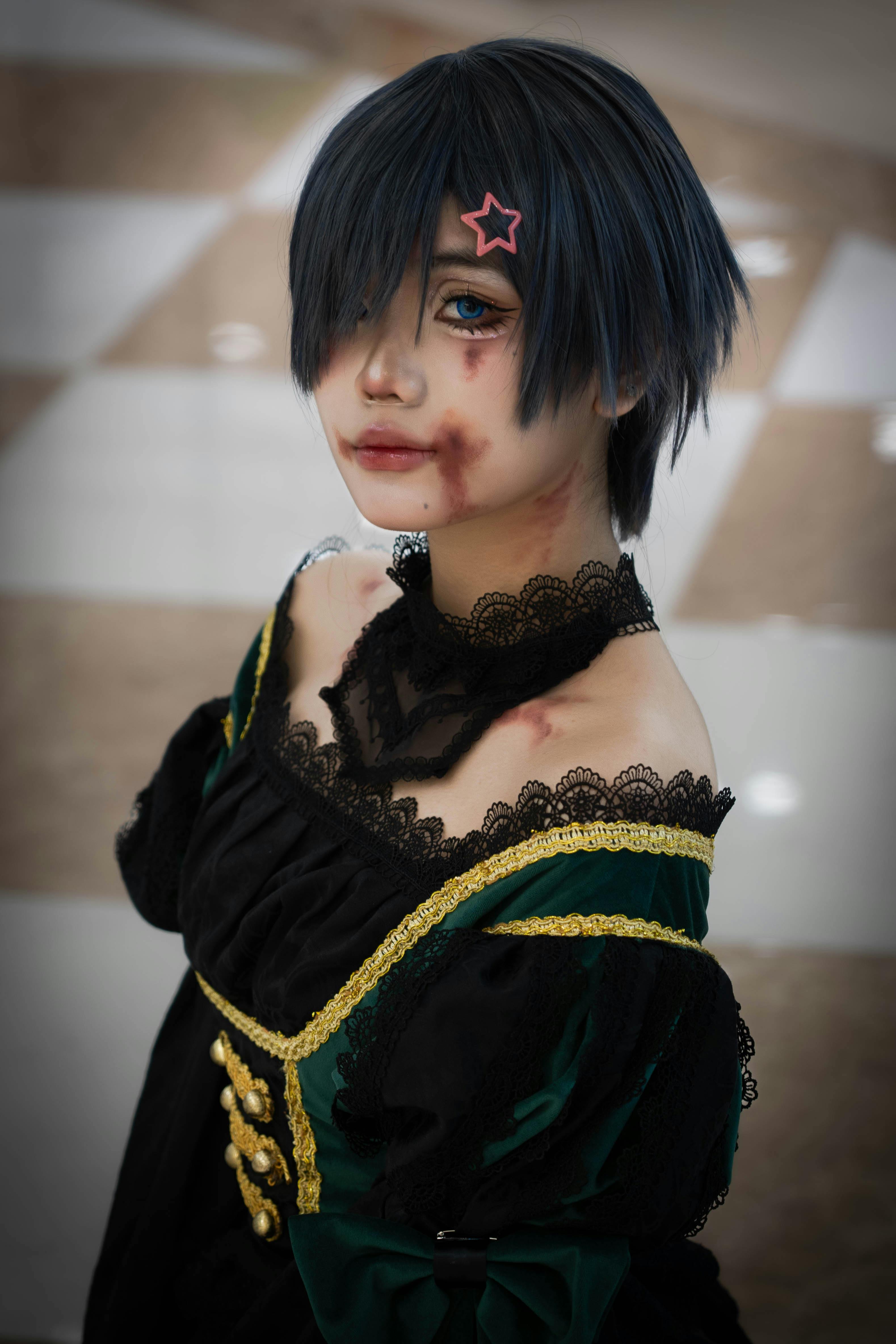 Cosplayer in Gothic Attire with Star Hairpin · Free Stock Photo