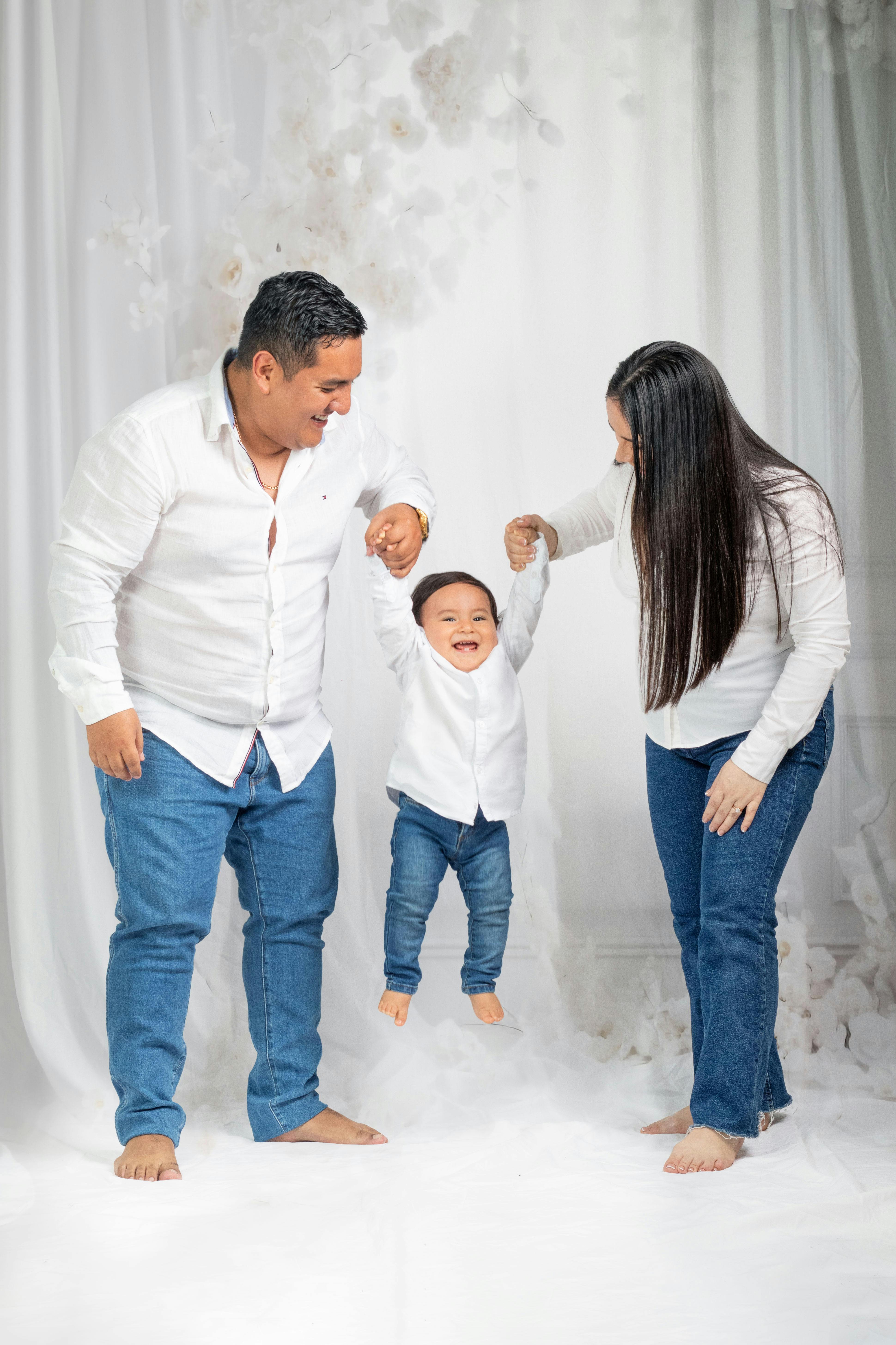 Happy Family Enjoying Indoor Playtime Together · Free Stock Photo