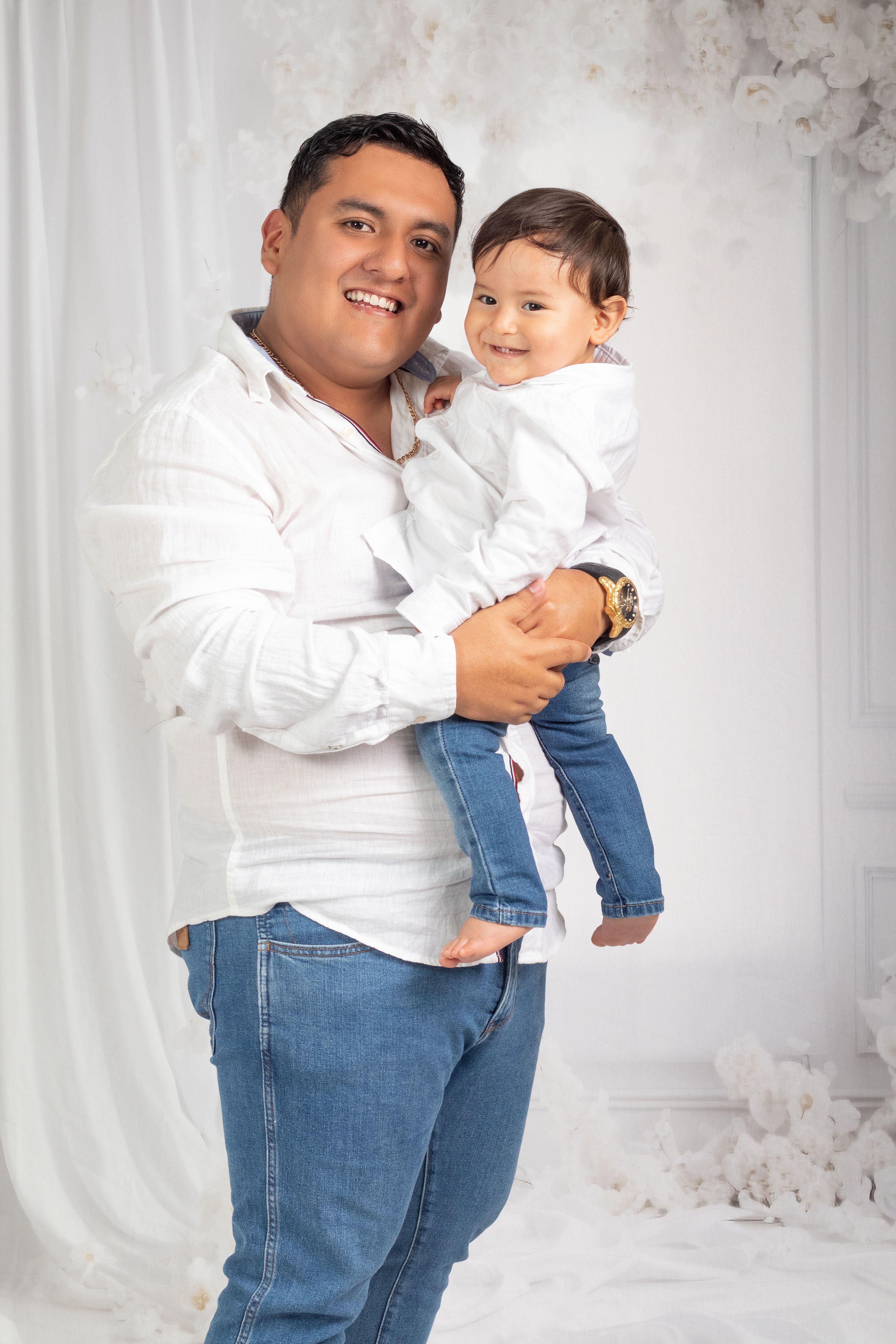 Father and Son Smiling in Studio Portrait · Free Stock Photo