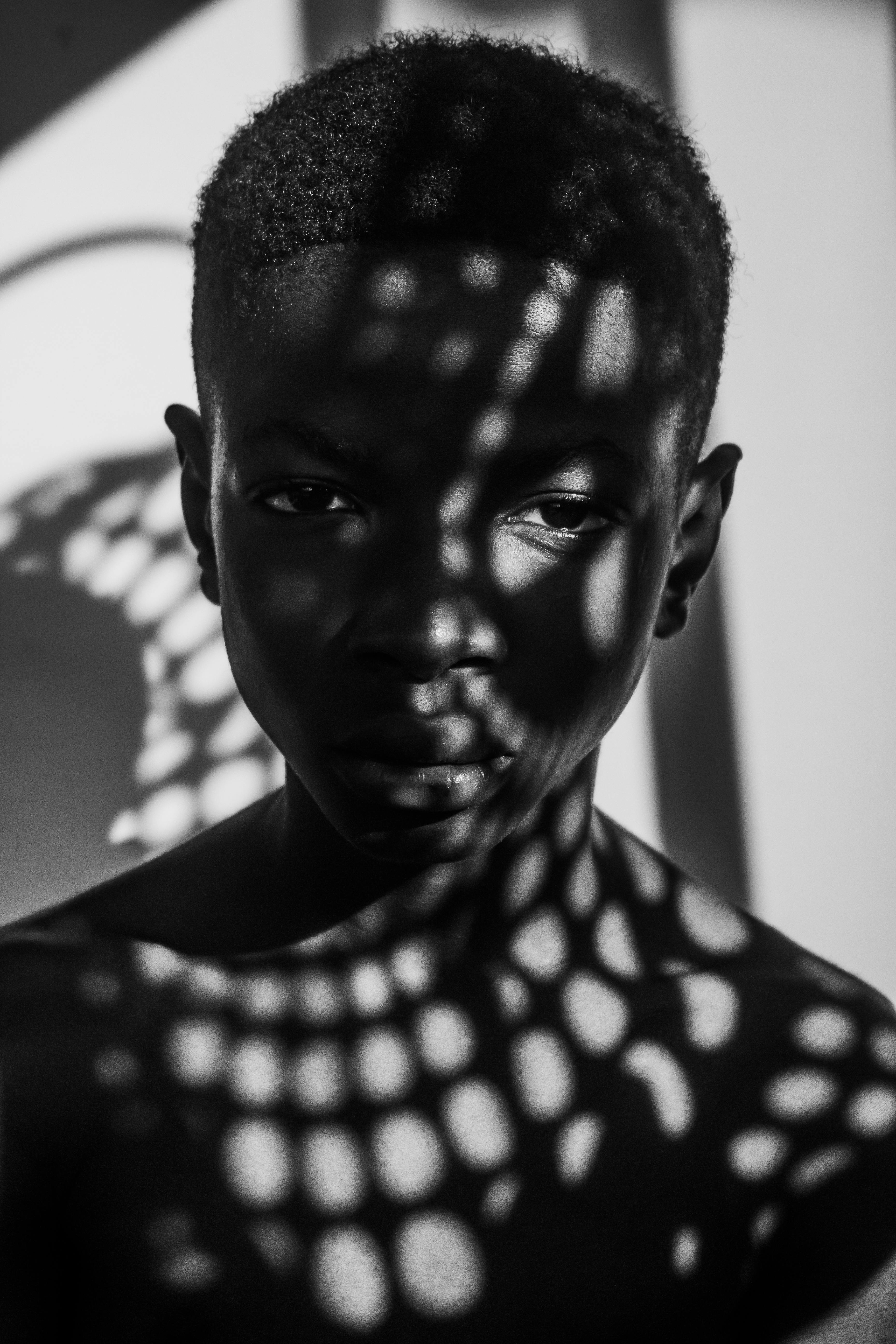 Monochrome Portrait with Dramatic Shadow Play · Free Stock Photo