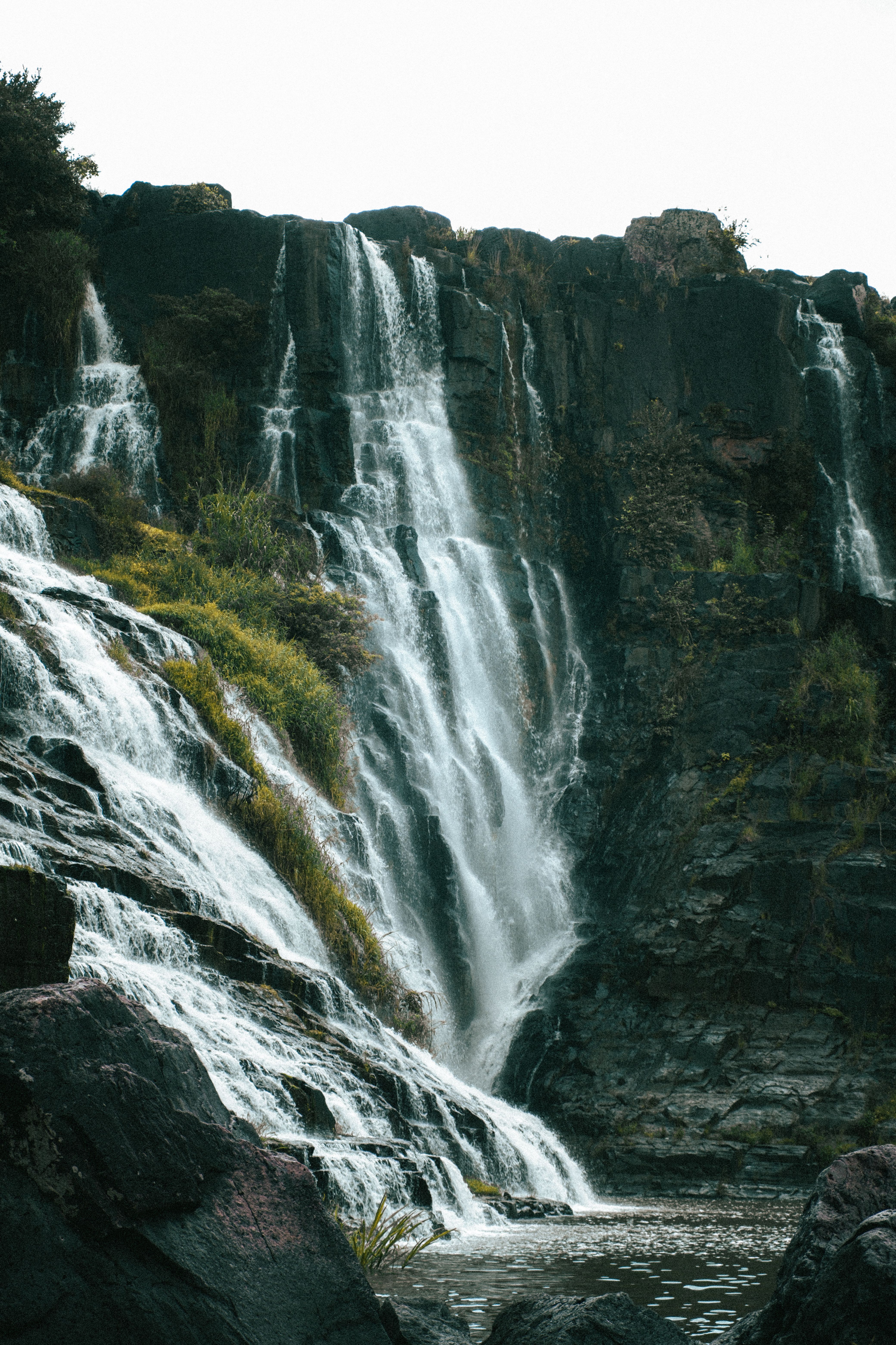 Majestic Waterfall Cascading Over Cliffs · Free Stock Photo