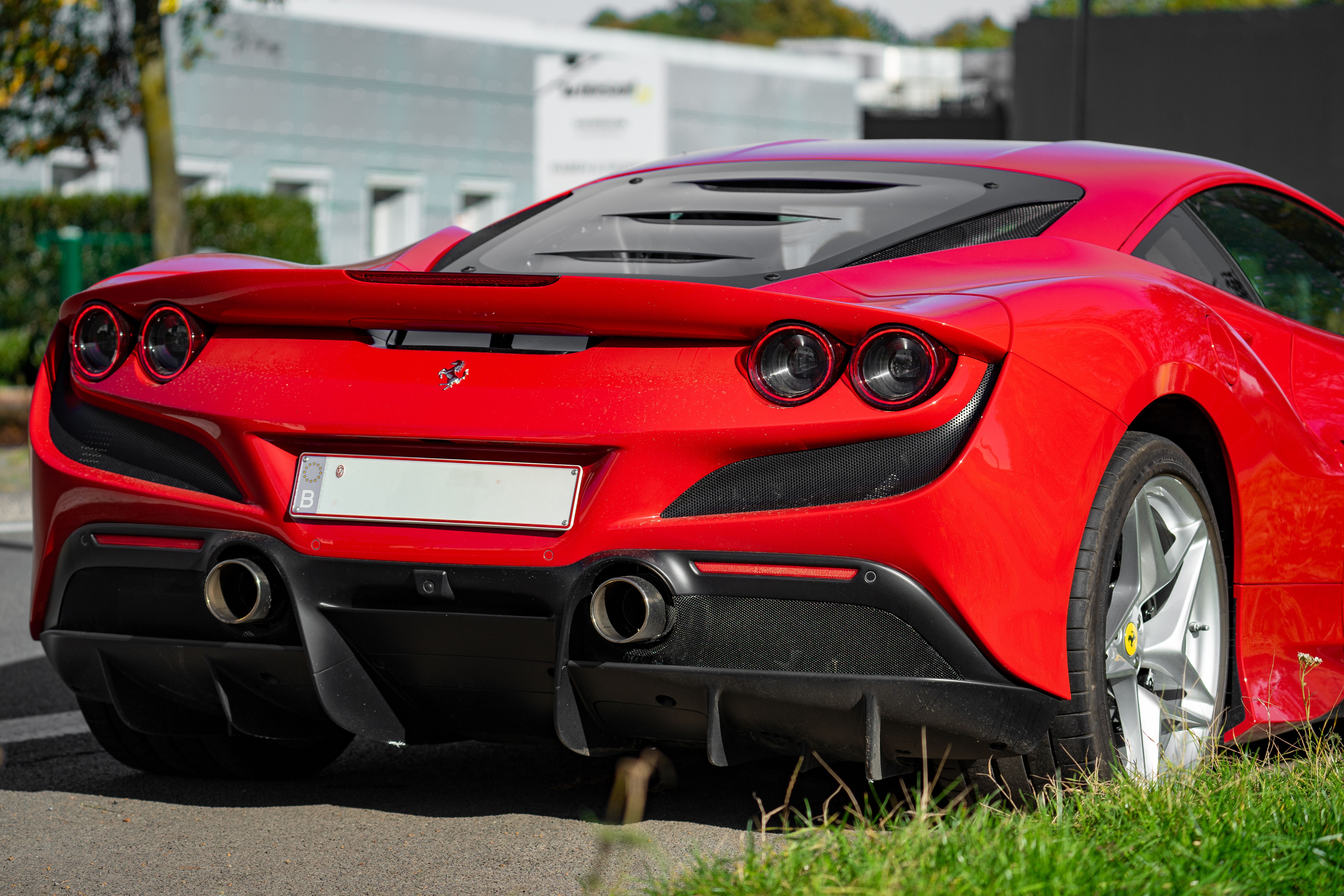 Rear View of a Red Sports Car on Street · Free Stock Photo