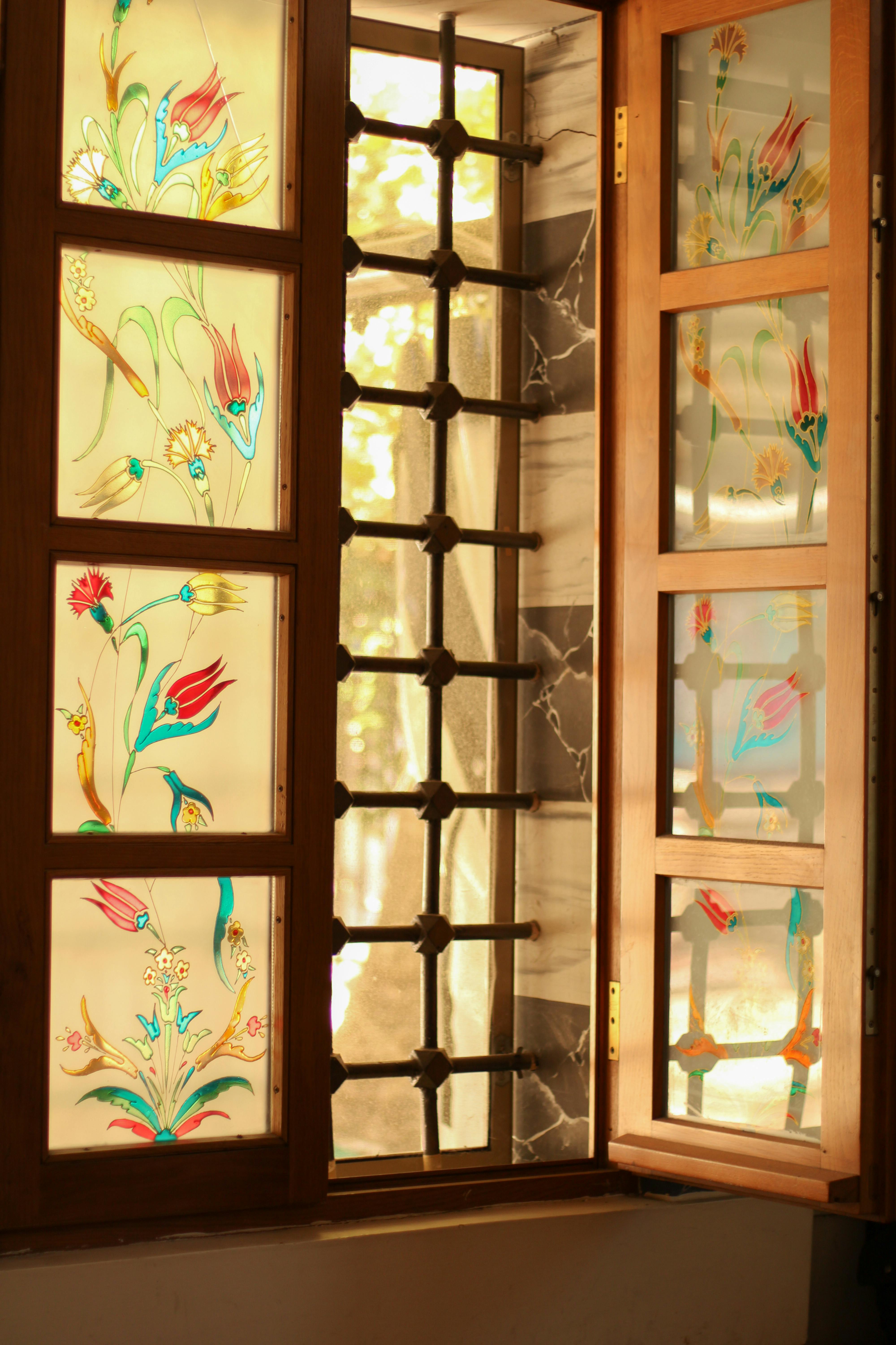 Colorful Stained Glass Window in Sunlight · Free Stock Photo