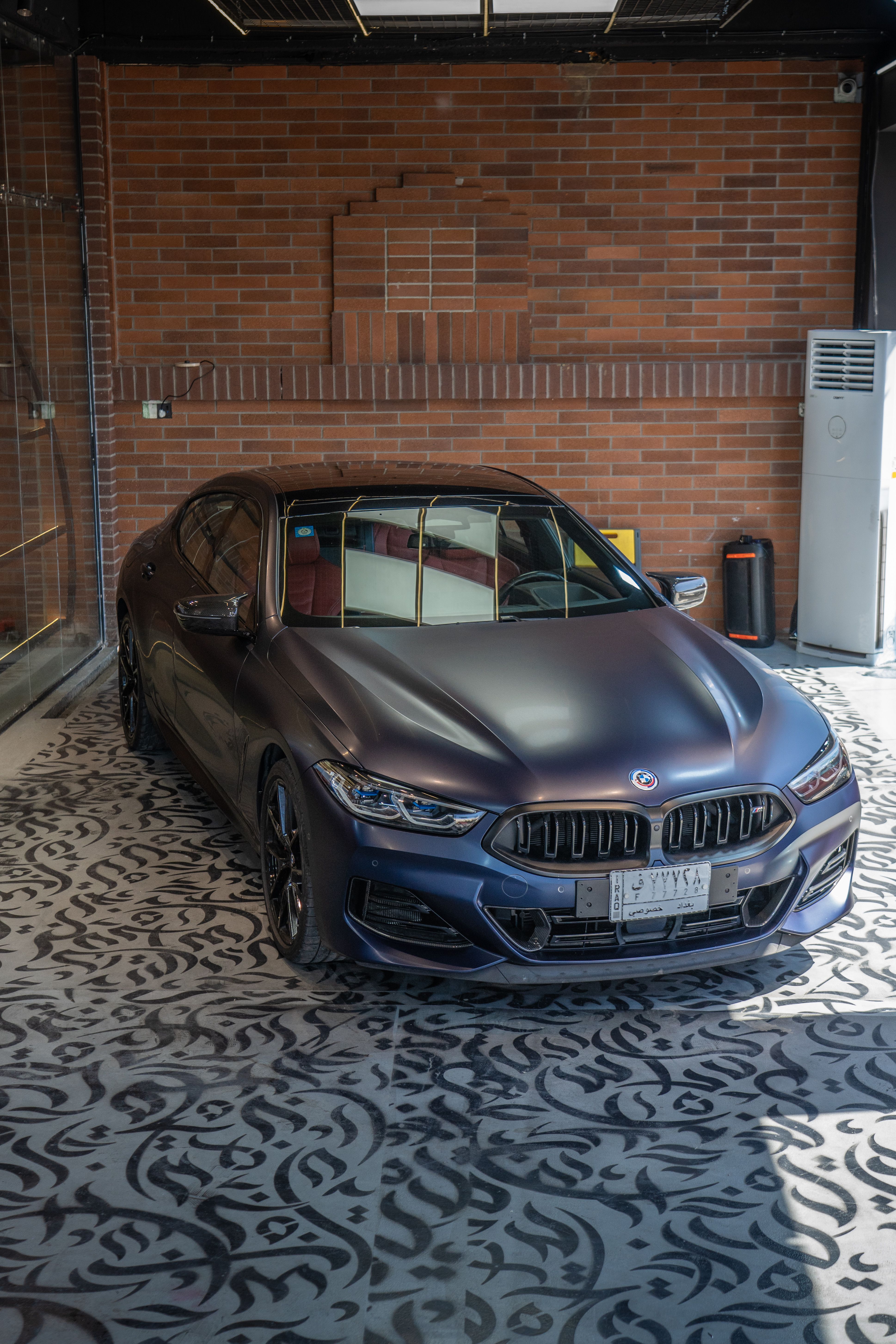 Luxury BMW Car Parked in Urban Garage · Free Stock Photo