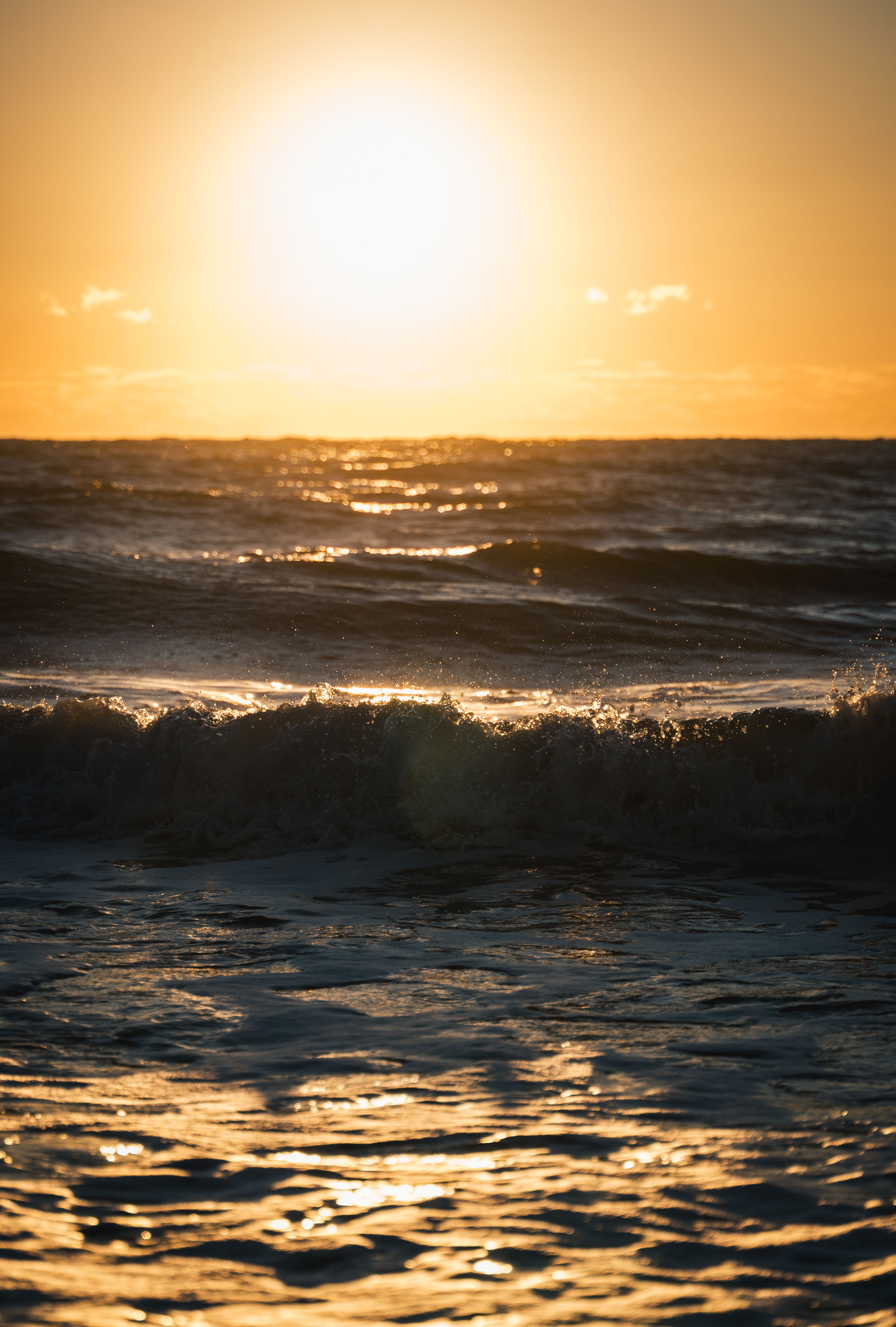 Golden Sunset over Ocean Waves · Free Stock Photo