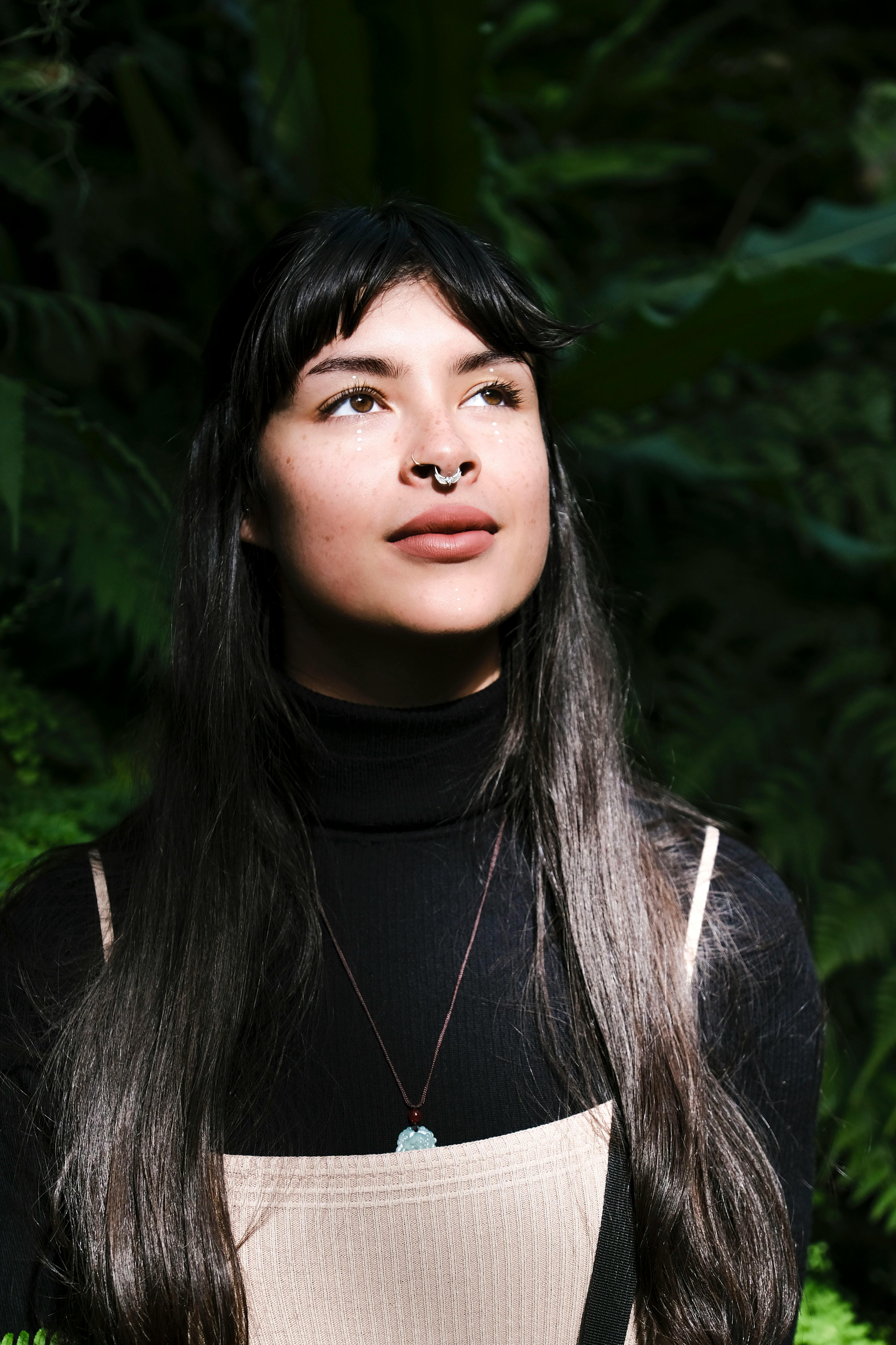 Peaceful Portrait of Woman in Lush Green Setting · Free Stock Photo