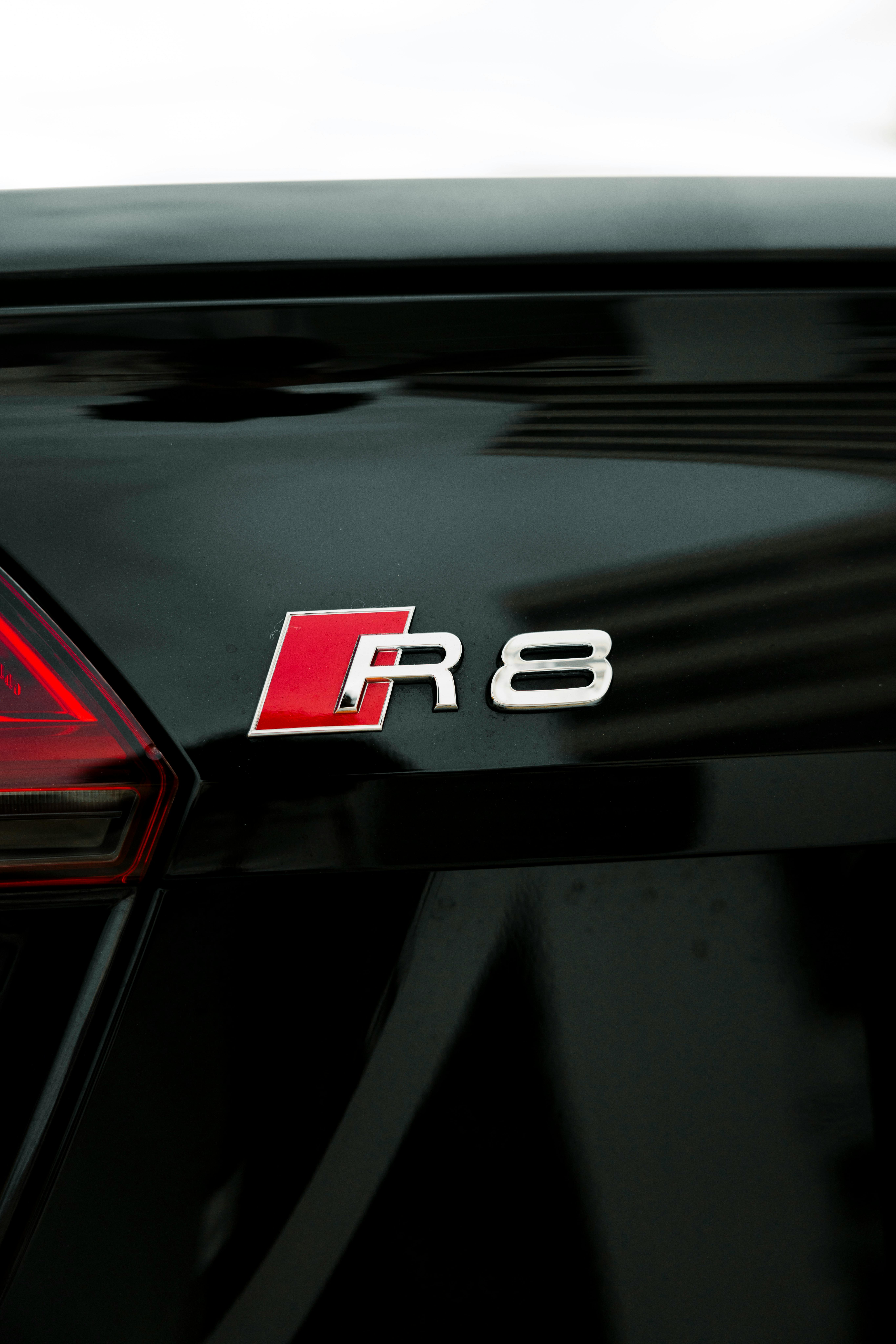 Close-up of Luxury Car Emblem on Black Vehicle · Free Stock Photo
