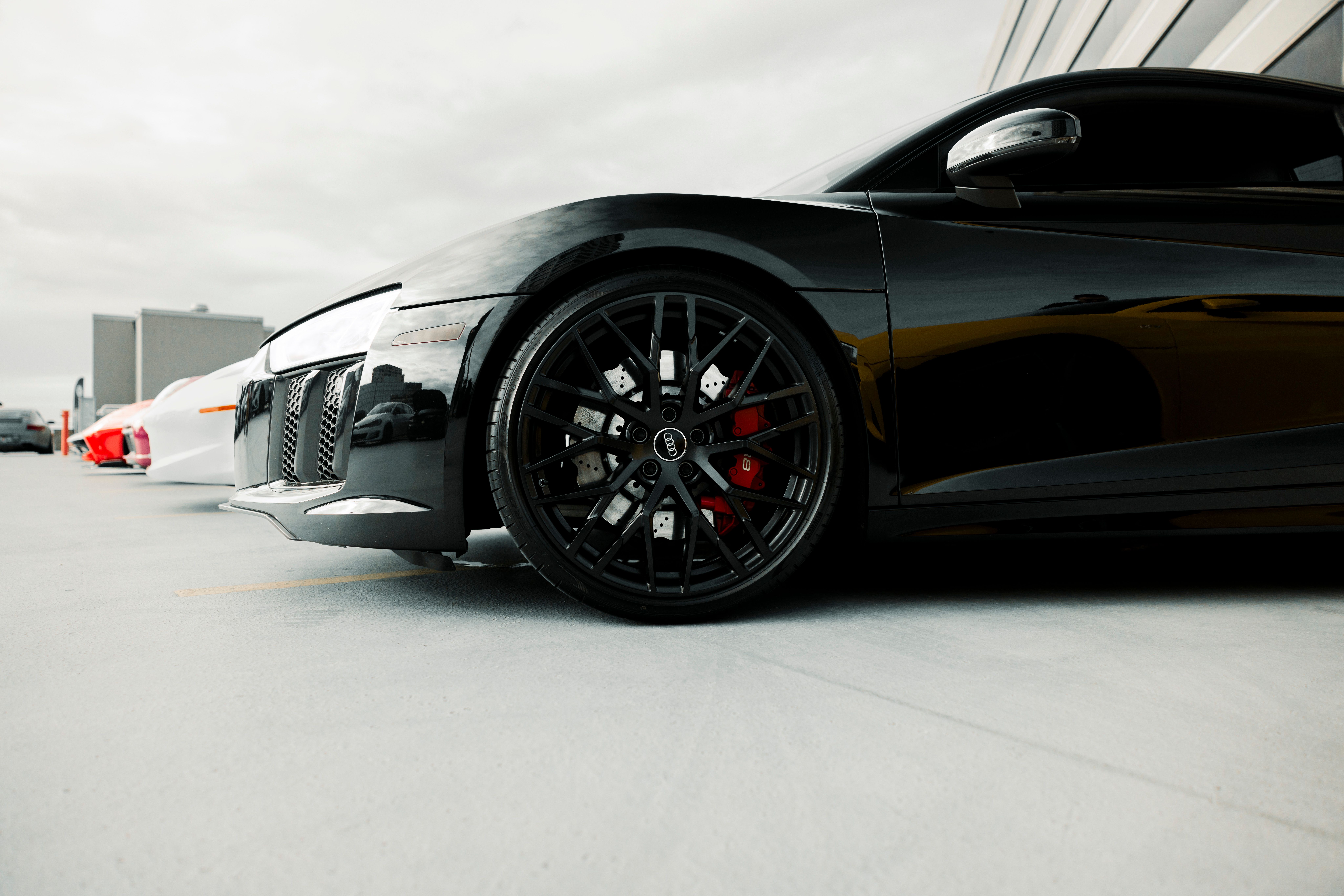 Sleek Black Luxury Sports Car Parked Outdoors · Free Stock Photo