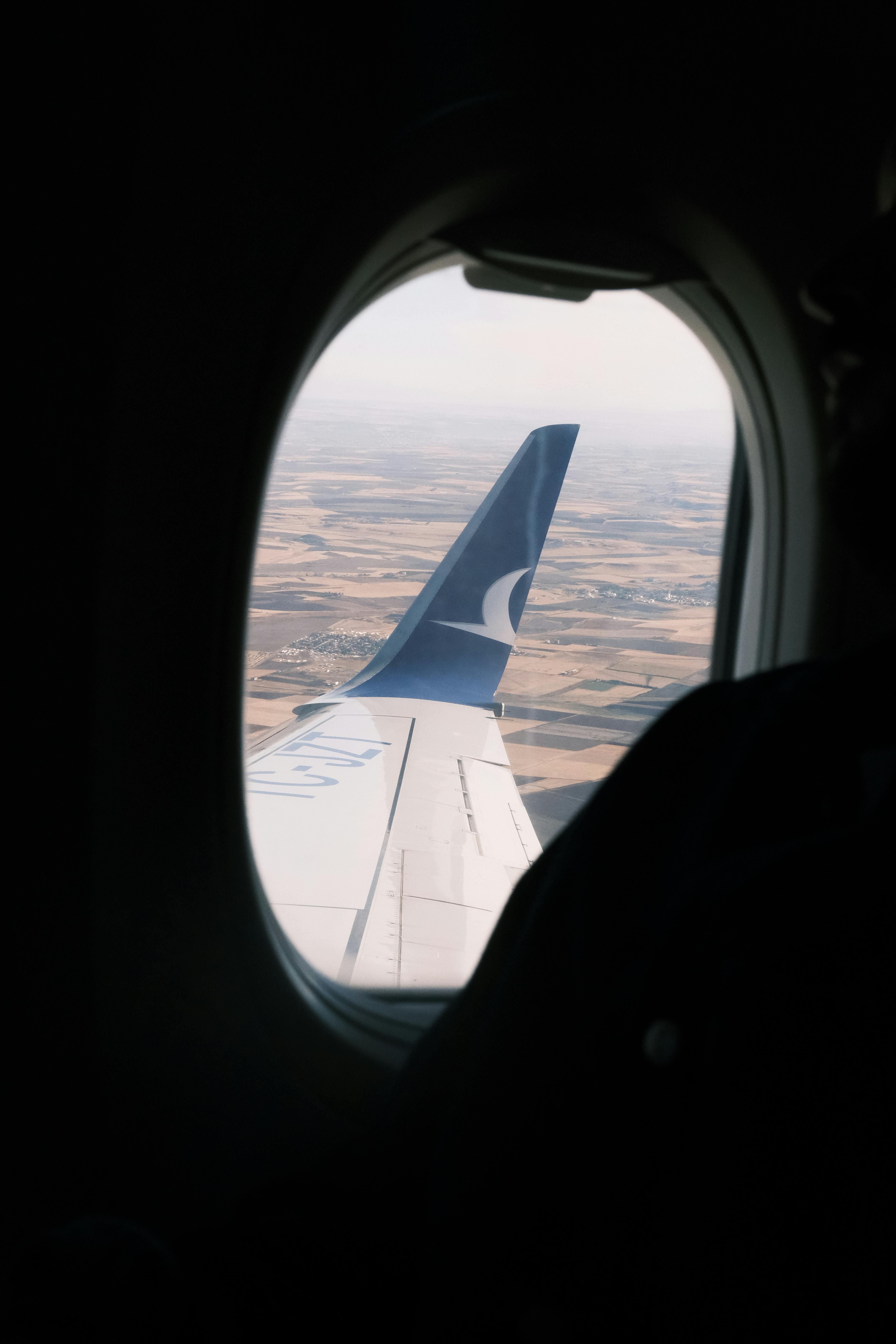 Person Riding on a Plane · Free Stock Photo