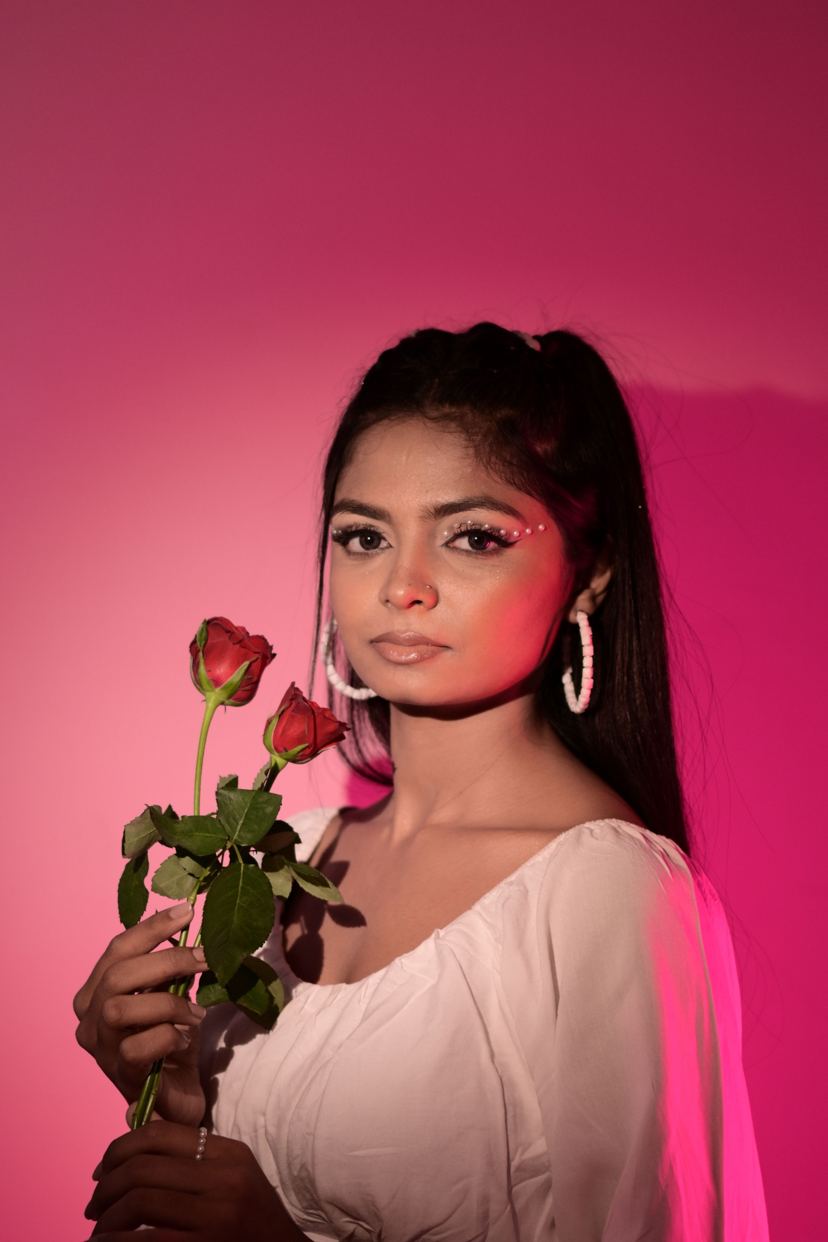 Elegant Portrait of Woman with Red Roses · Free Stock Photo