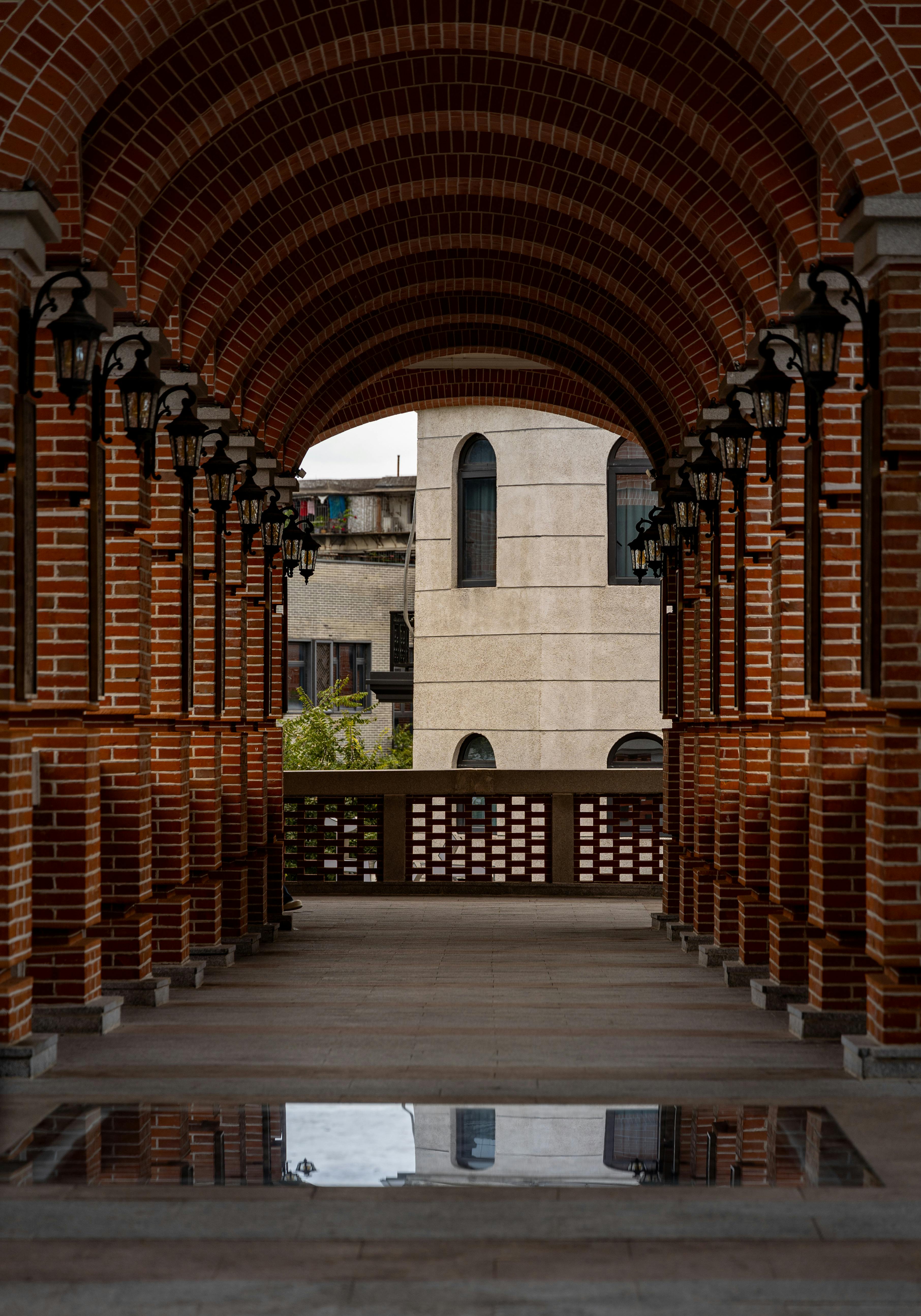 Architectural Brick Archway with Urban View · Free Stock Photo