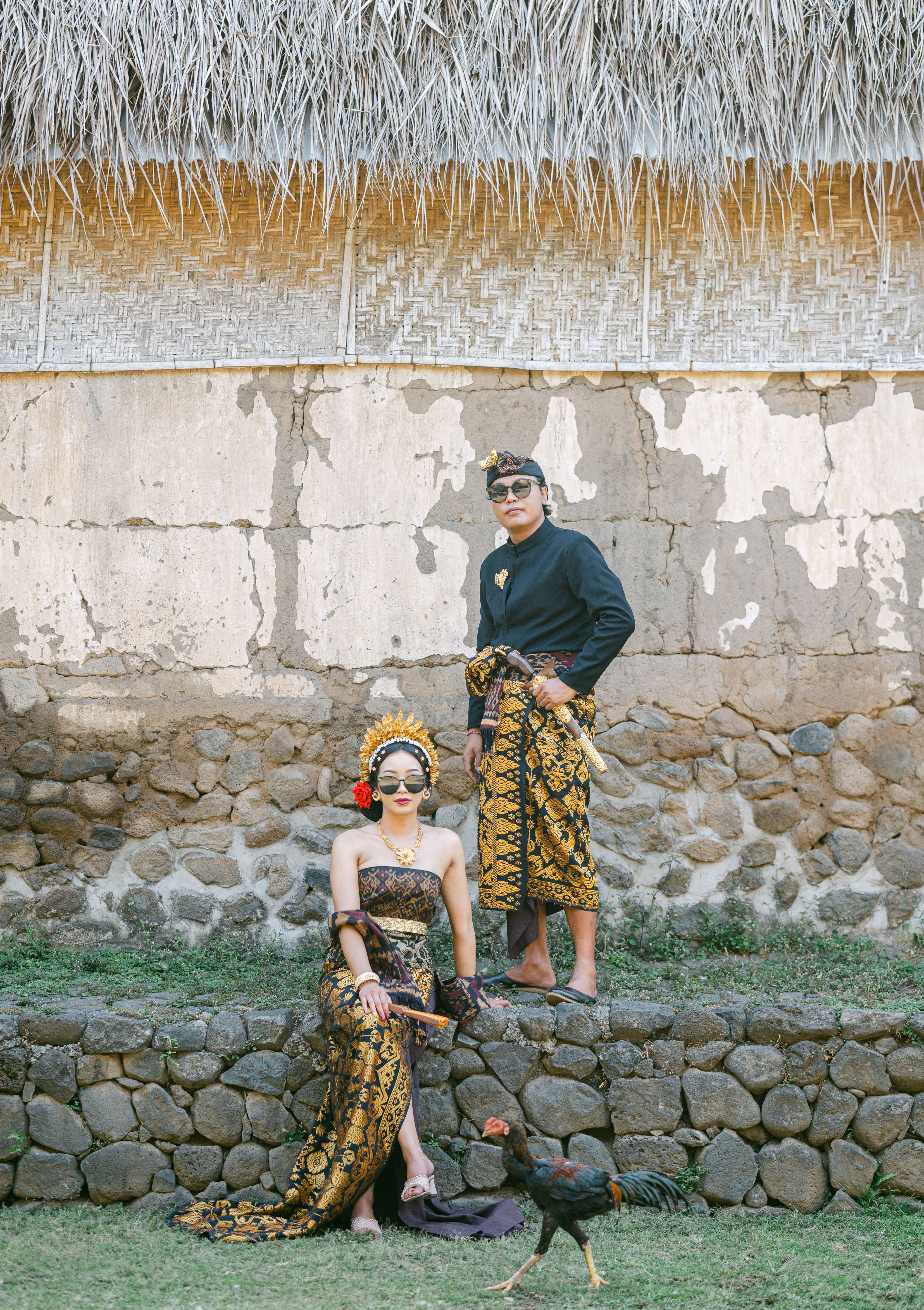 Traditional Balinese Attire with Rooster · Free Stock Photo