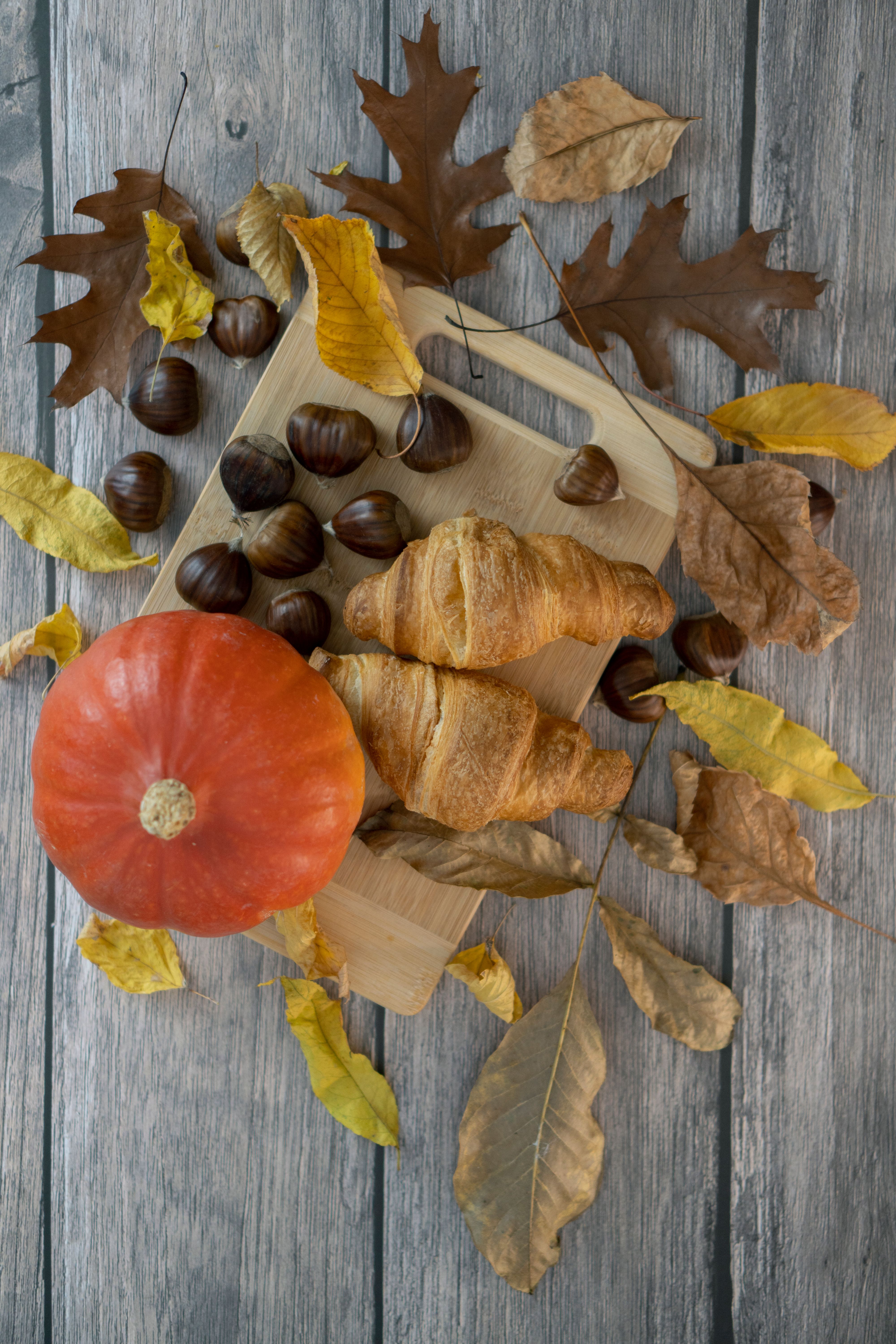 Autumn Breakfast Scene with Croissants and Pumpkin · Free Stock Photo