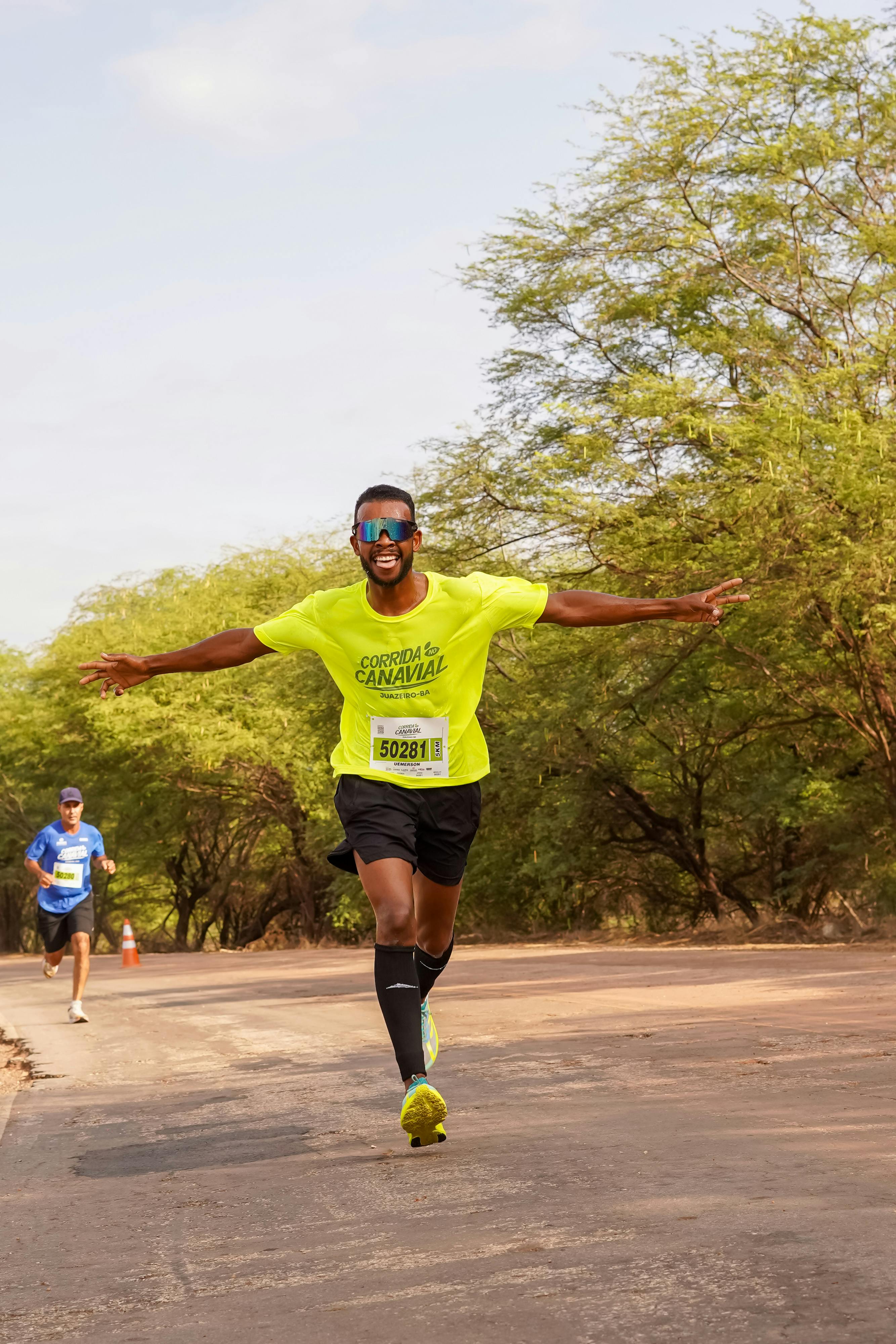 Energetic Runner Celebrating Victory · Free Stock Photo