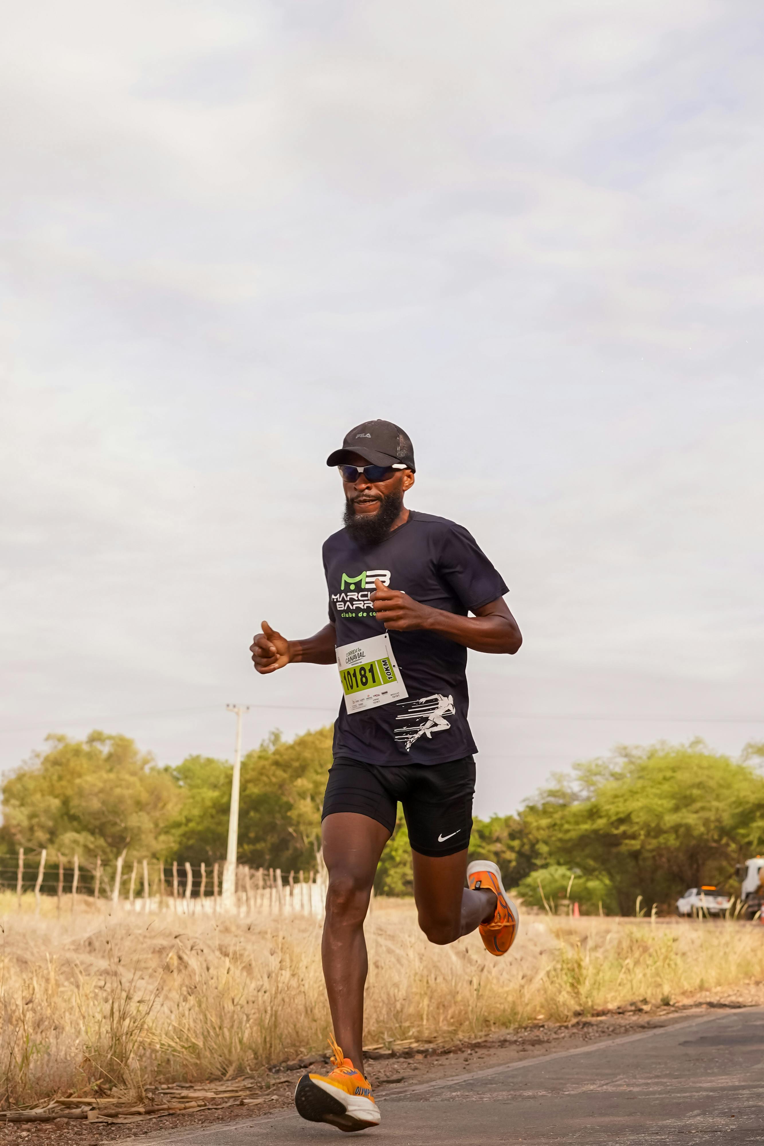 Man Running in Outdoor Marathon Event · Free Stock Photo