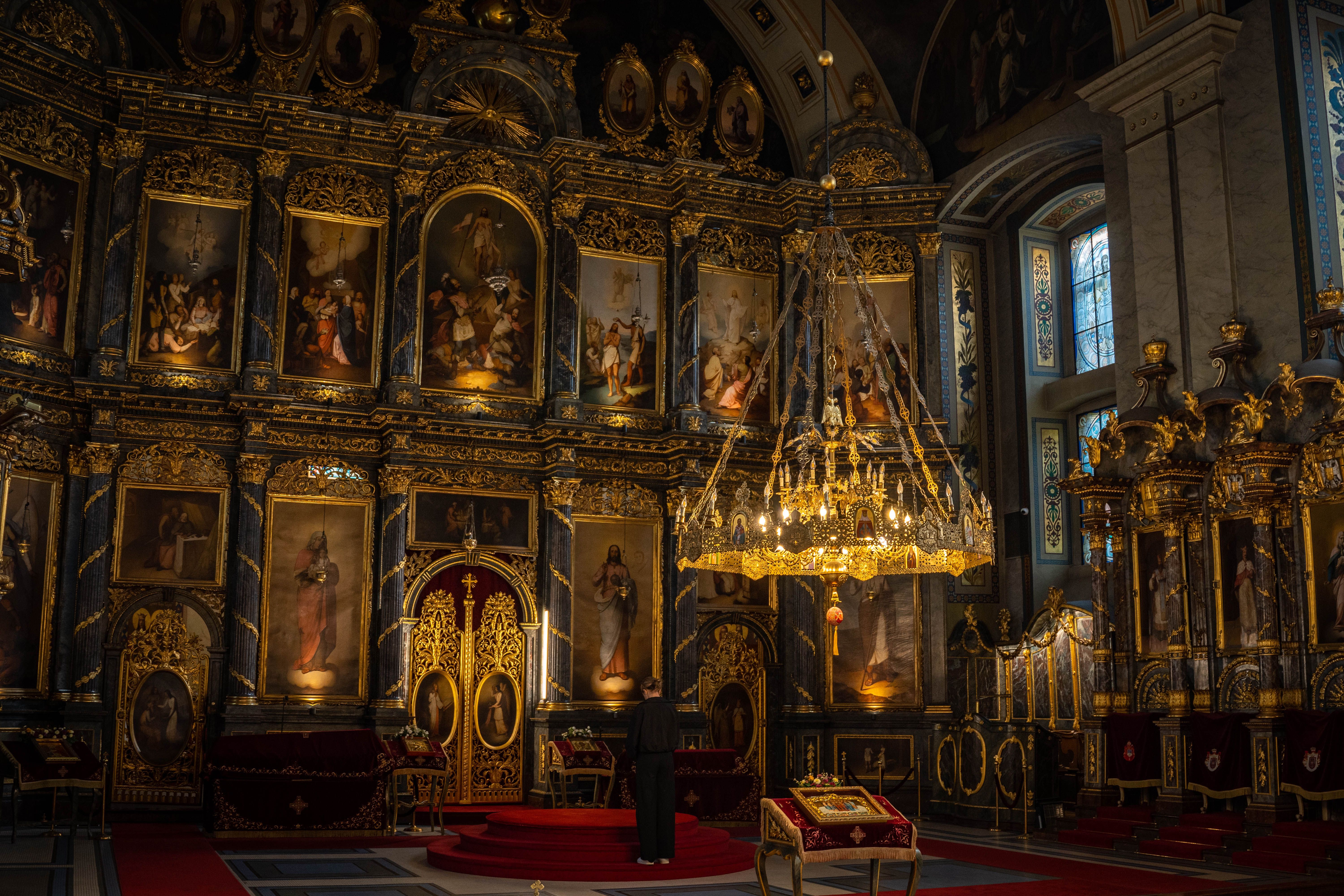 Ornate Church Interior with Golden Chandelier · Free Stock Photo