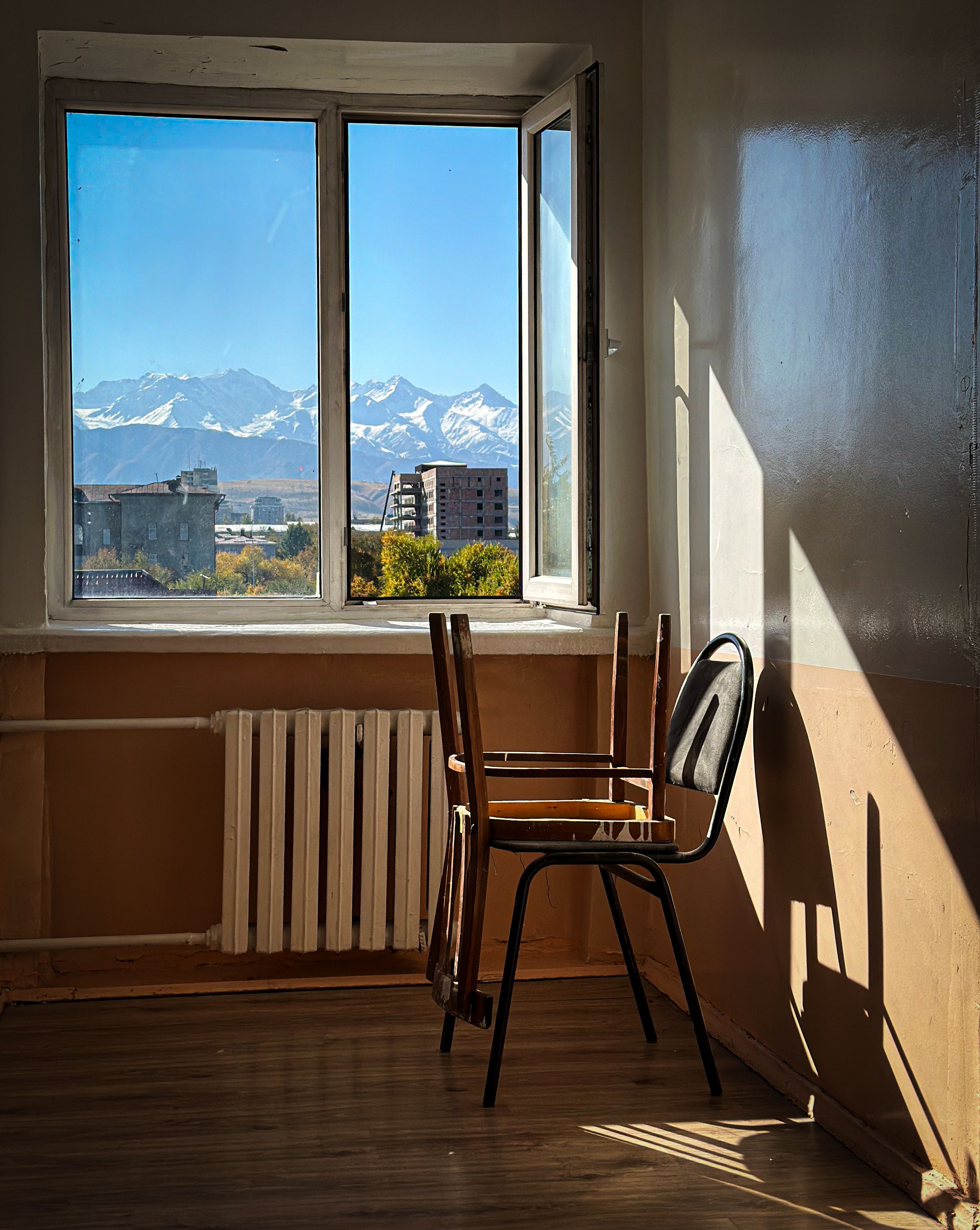 Sunny Room with Mountain View Through Window · Free Stock Photo